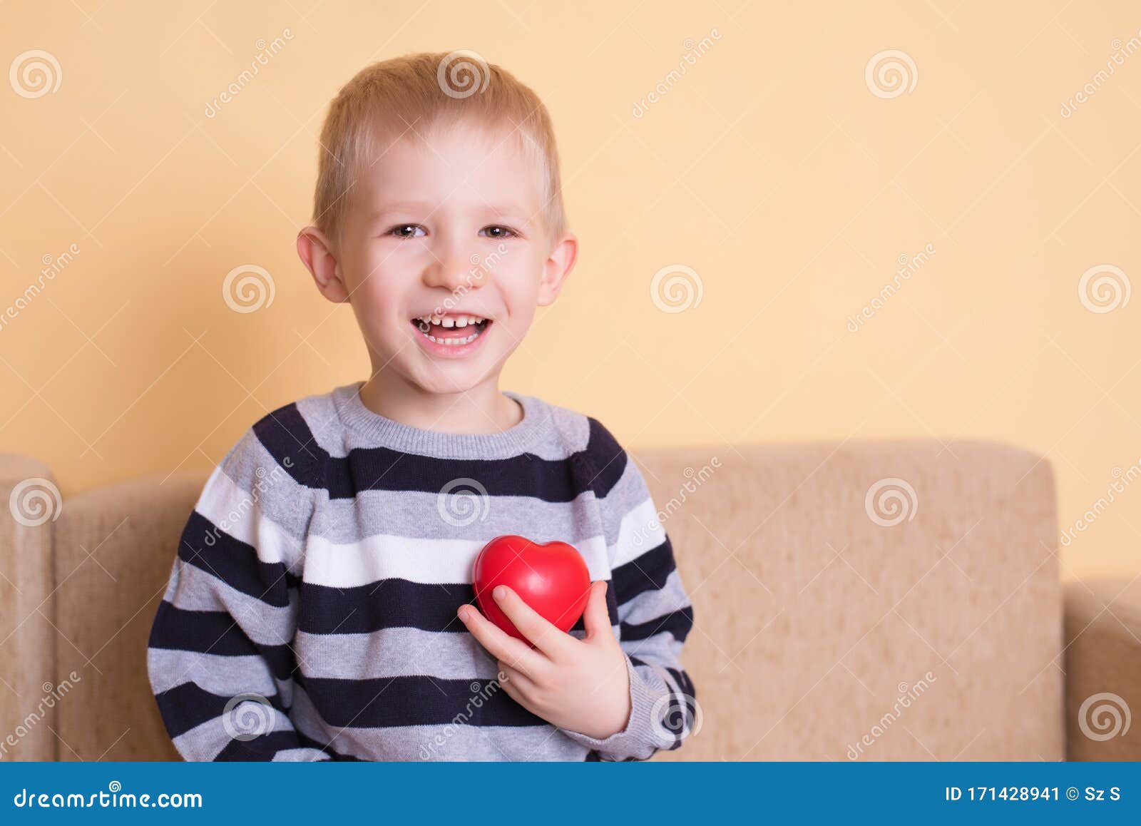 Adorable Blond Kid Holding a Love Symbol Stock Image - Image of ...