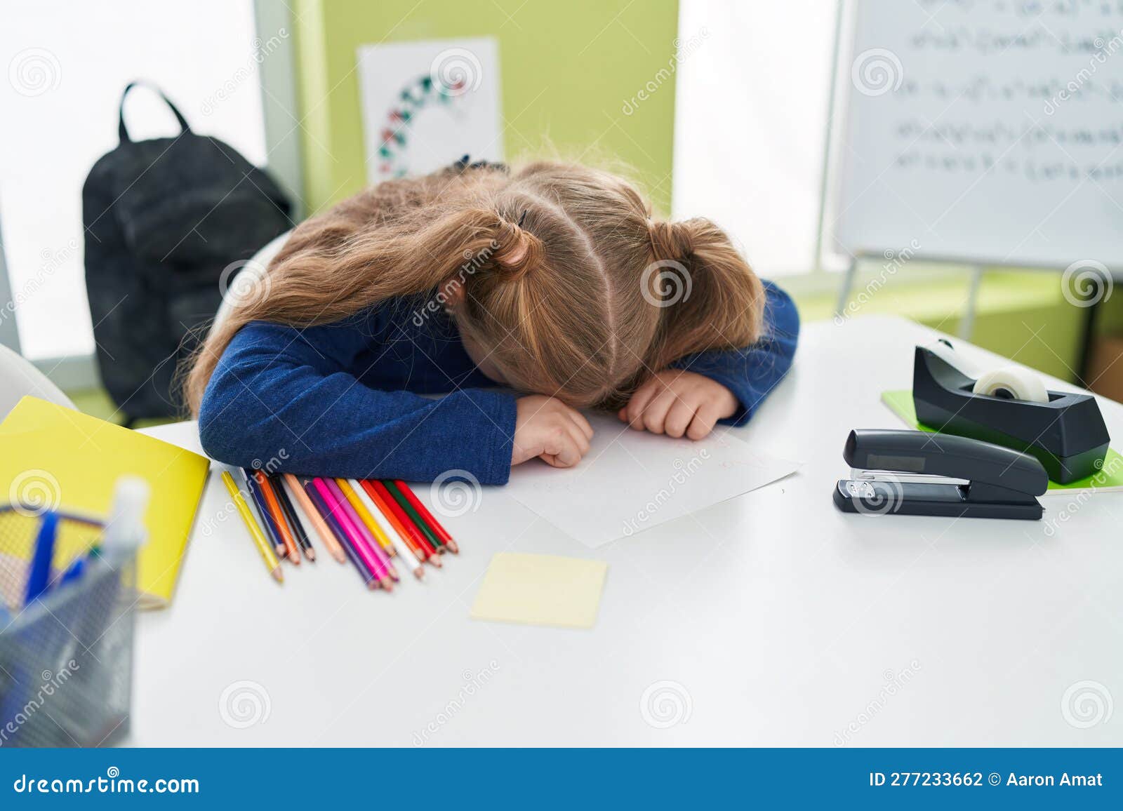 Adorable Blonde Girl Student Sleeping with Head on Table at Classroom ...