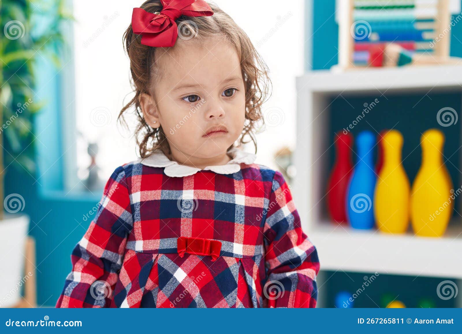 Adorable Blonde Toddler Standing with Serious Expression at ...