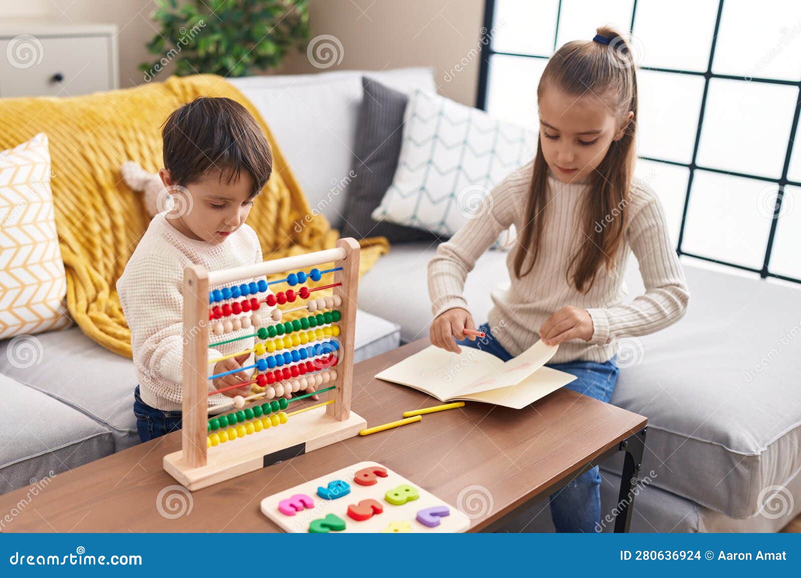 Adorable Boy and Girl Playing with Abacus Drawing on Notebook at Home Stock Photo - Image of ...