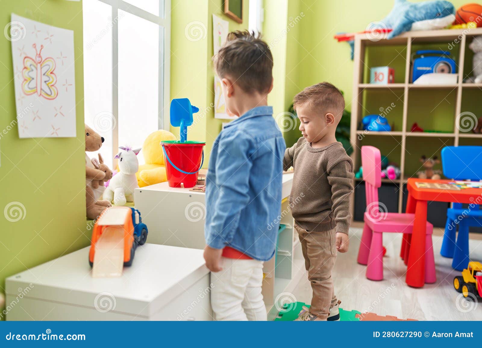 Adorable Boys Standing with Relaxed Expression Playing at Kindergarten ...