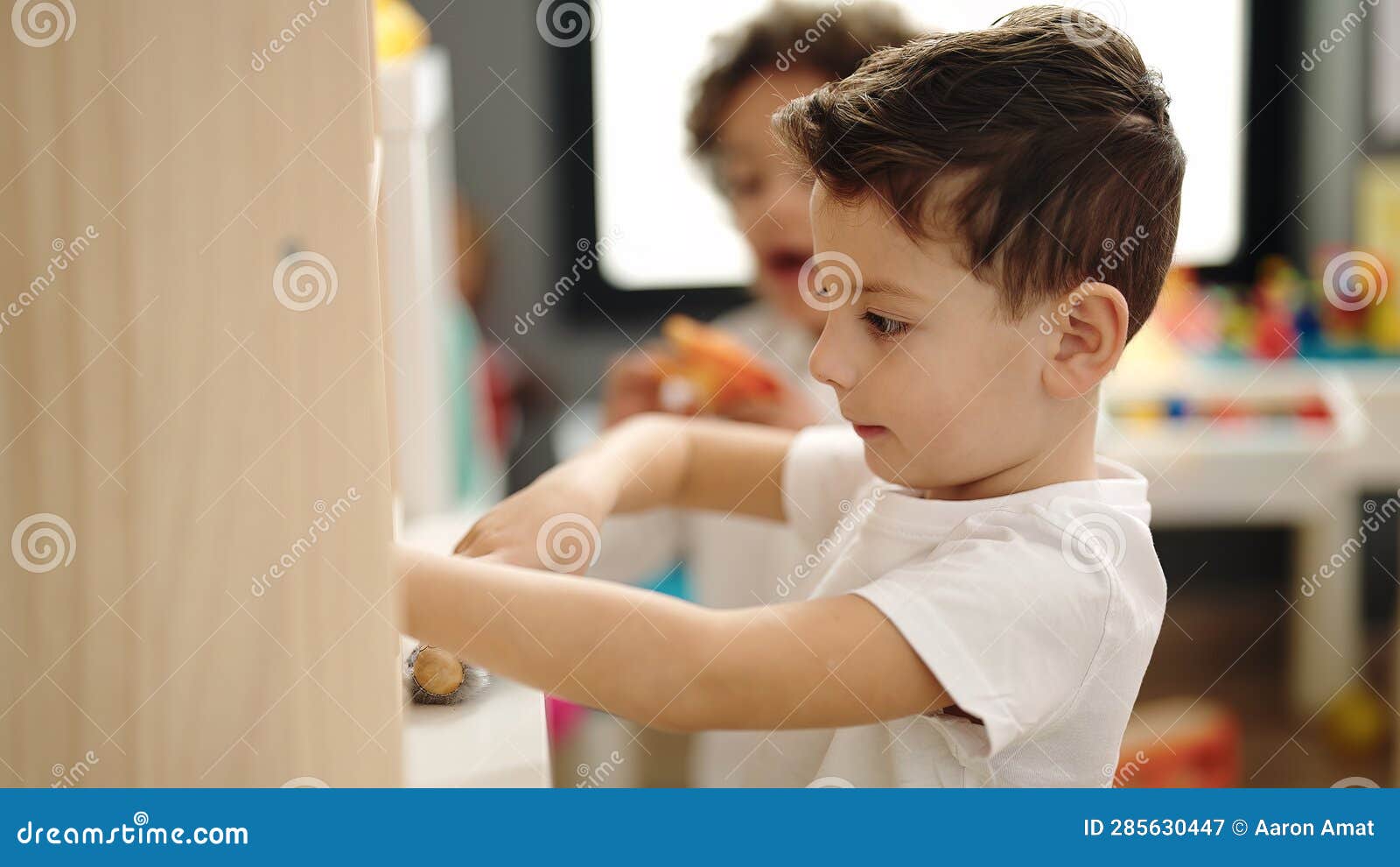 Adorable Boys Standing with Relaxed Expression Playing at Kindergarten ...