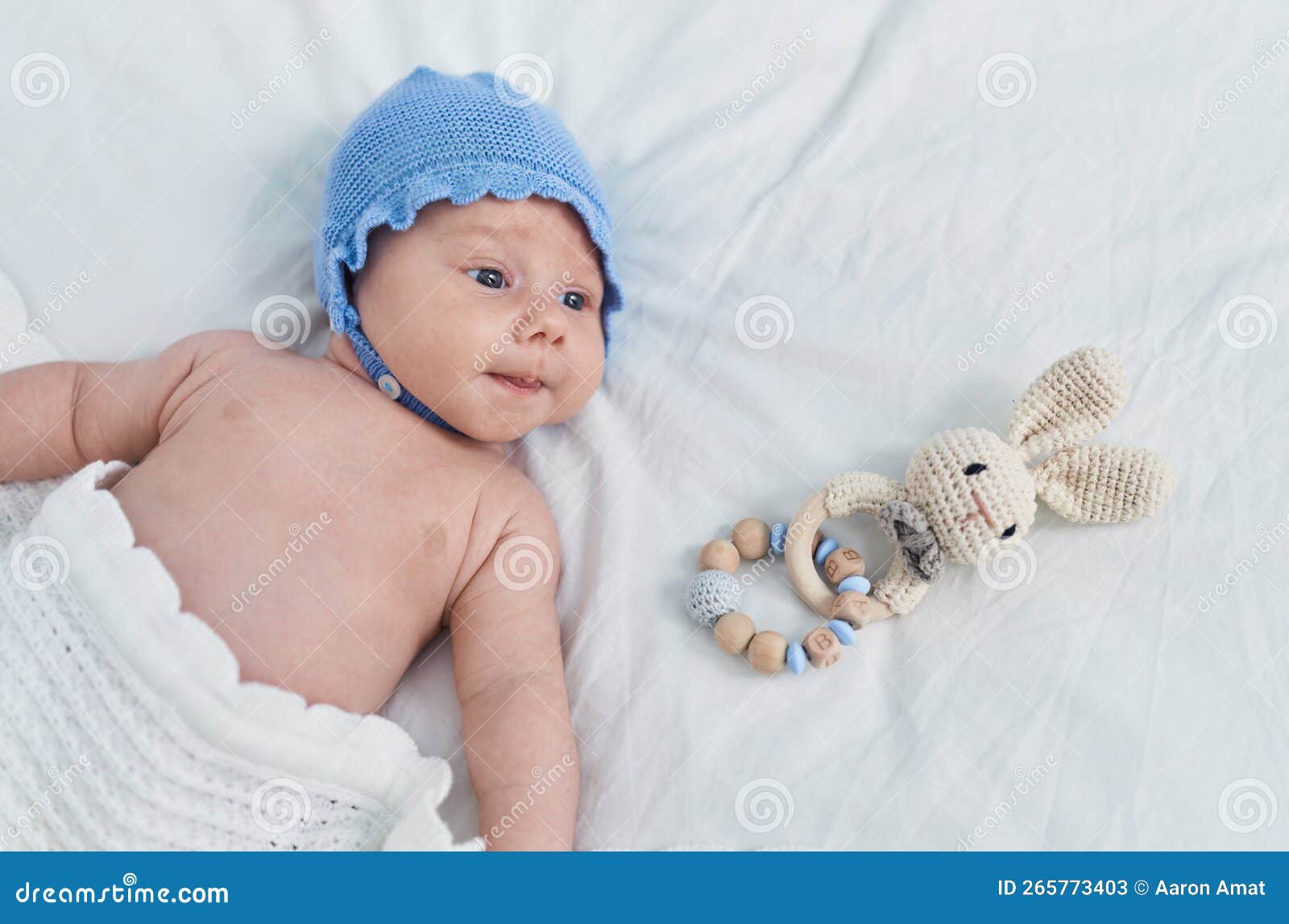 Adorable Caucasian Baby Lying on Bed with Relaxed Expression at Bedroom ...