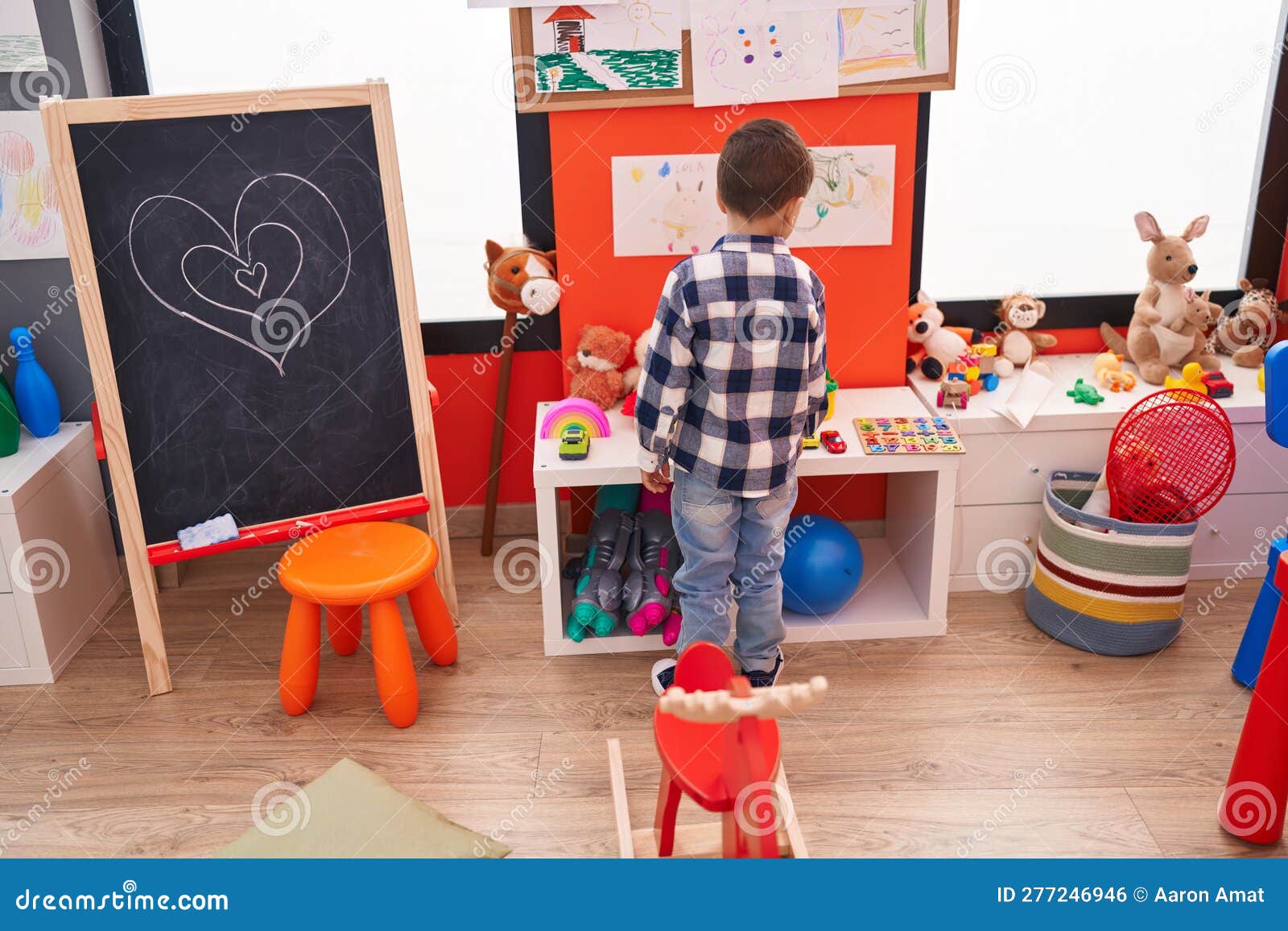 Adorable Caucasian Boy Playing on Back View at Kindergarten Stock Photo ...