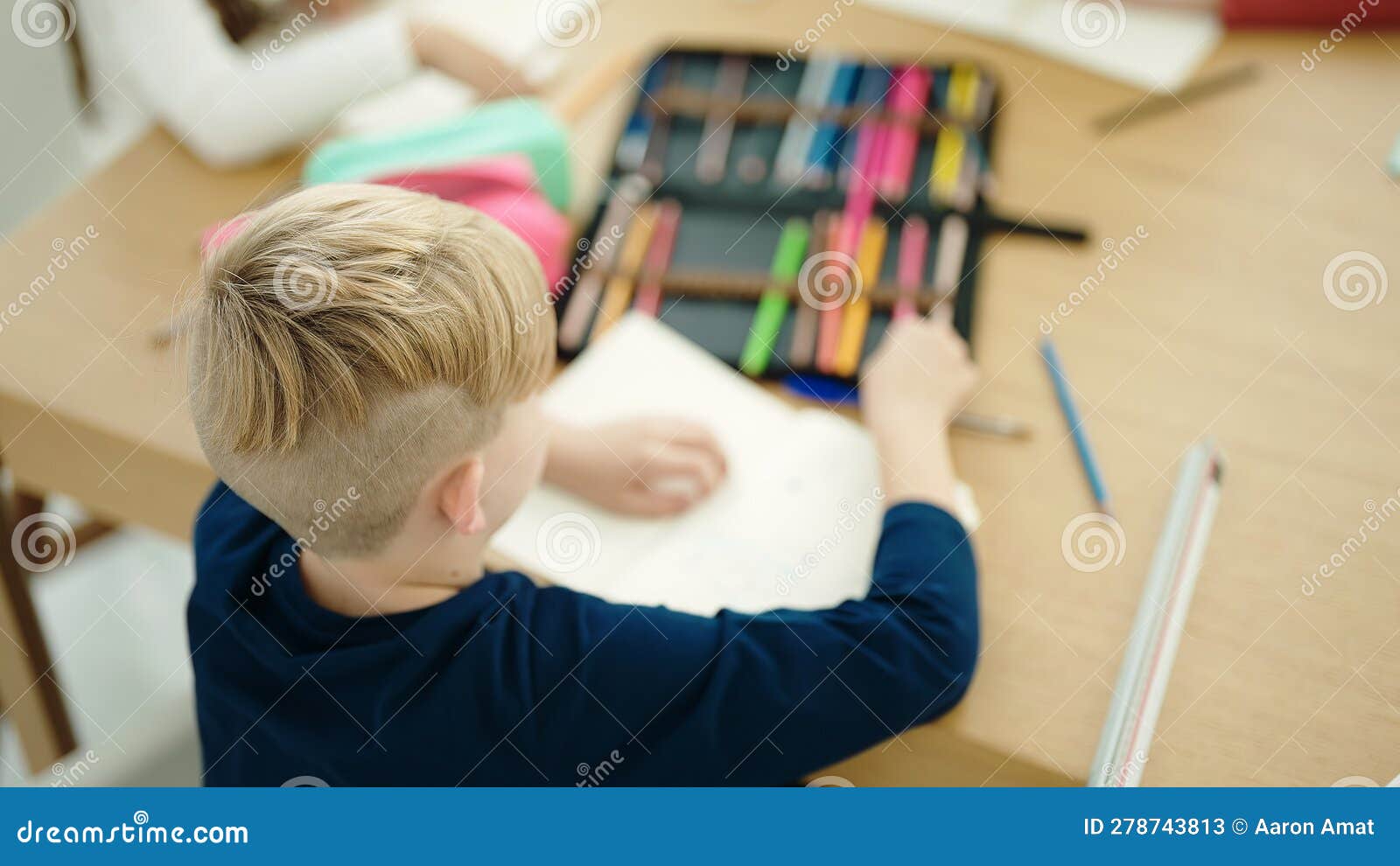 Adorable Caucasian Boy Student Drawing on Notebook Sitting on Table at ...