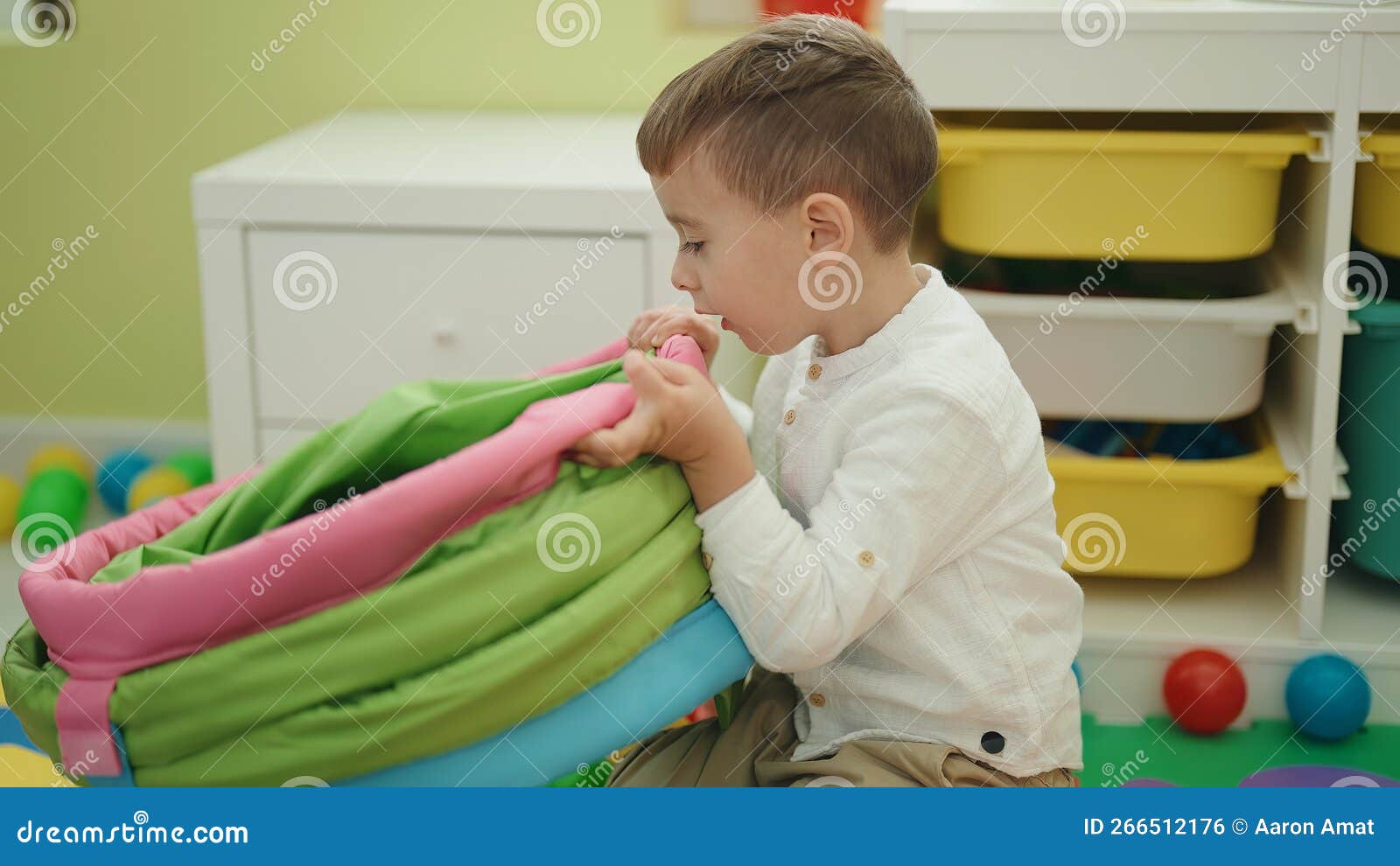 Adorable Caucasian Boy Student Sitting on Floor with Relaxed Expression ...