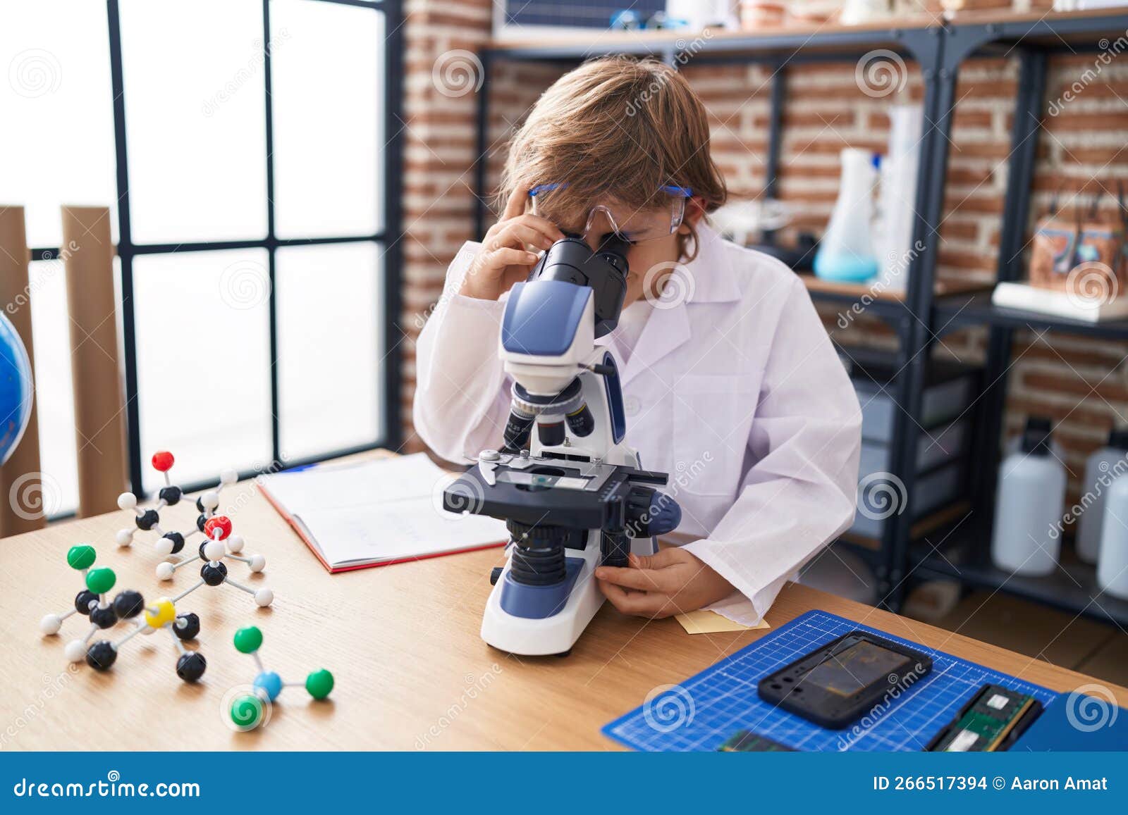 Adorable Caucasian Boy Student Using Microscope at Classroom Stock ...