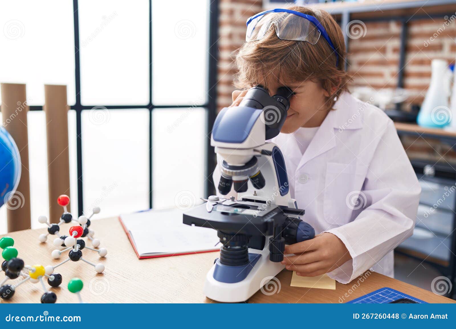 Adorable Caucasian Boy Student Using Microscope at Classroom Stock ...