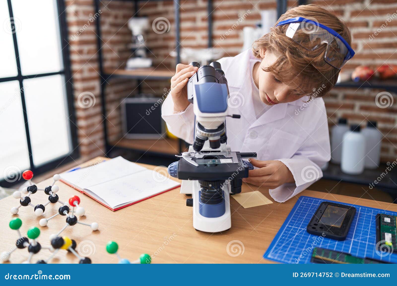 Adorable Caucasian Boy Student Using Microscope at Classroom Stock ...