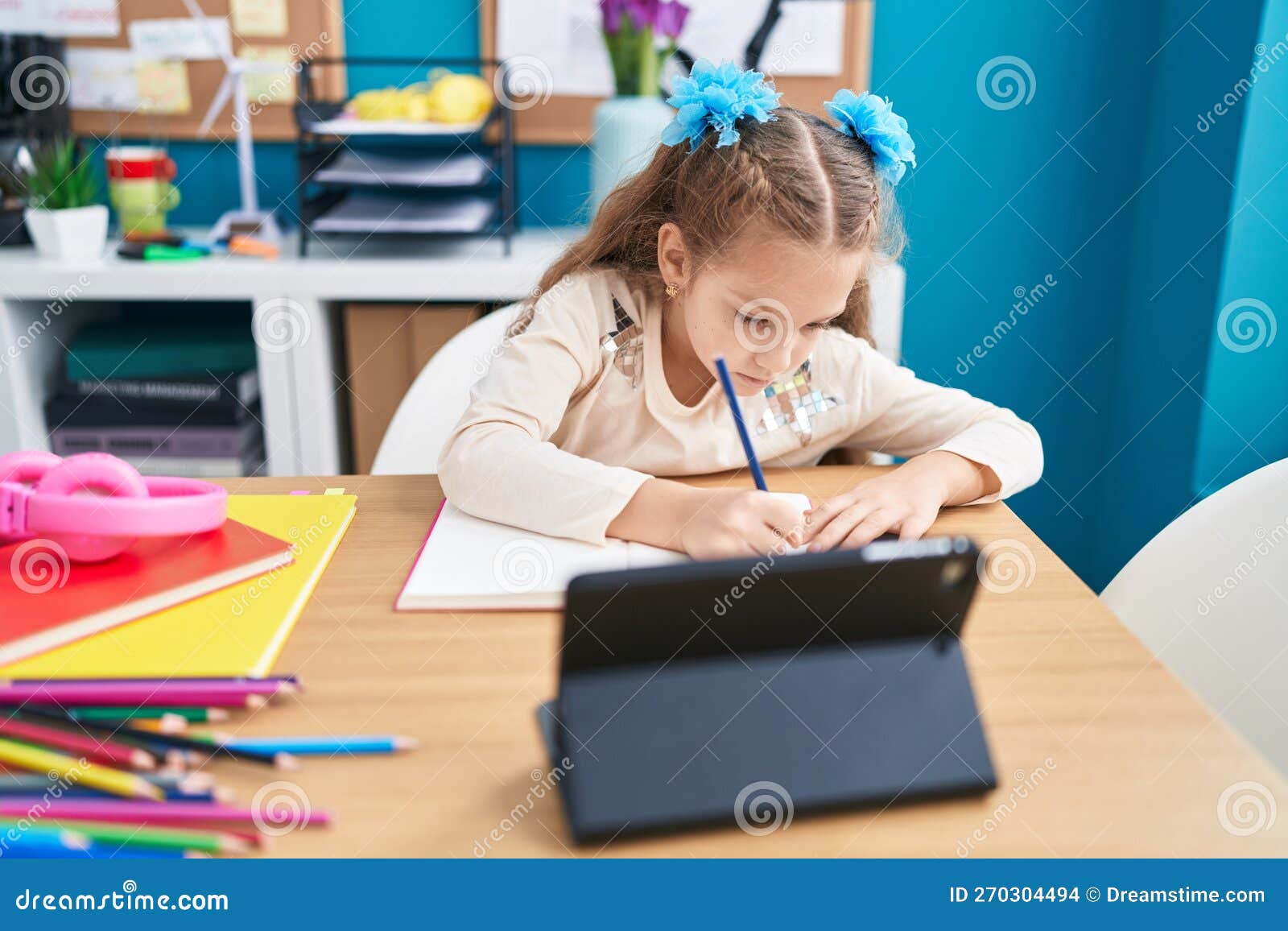 Adorable Caucasian Girl Student Using Touchpad Writing on Notebook at ...
