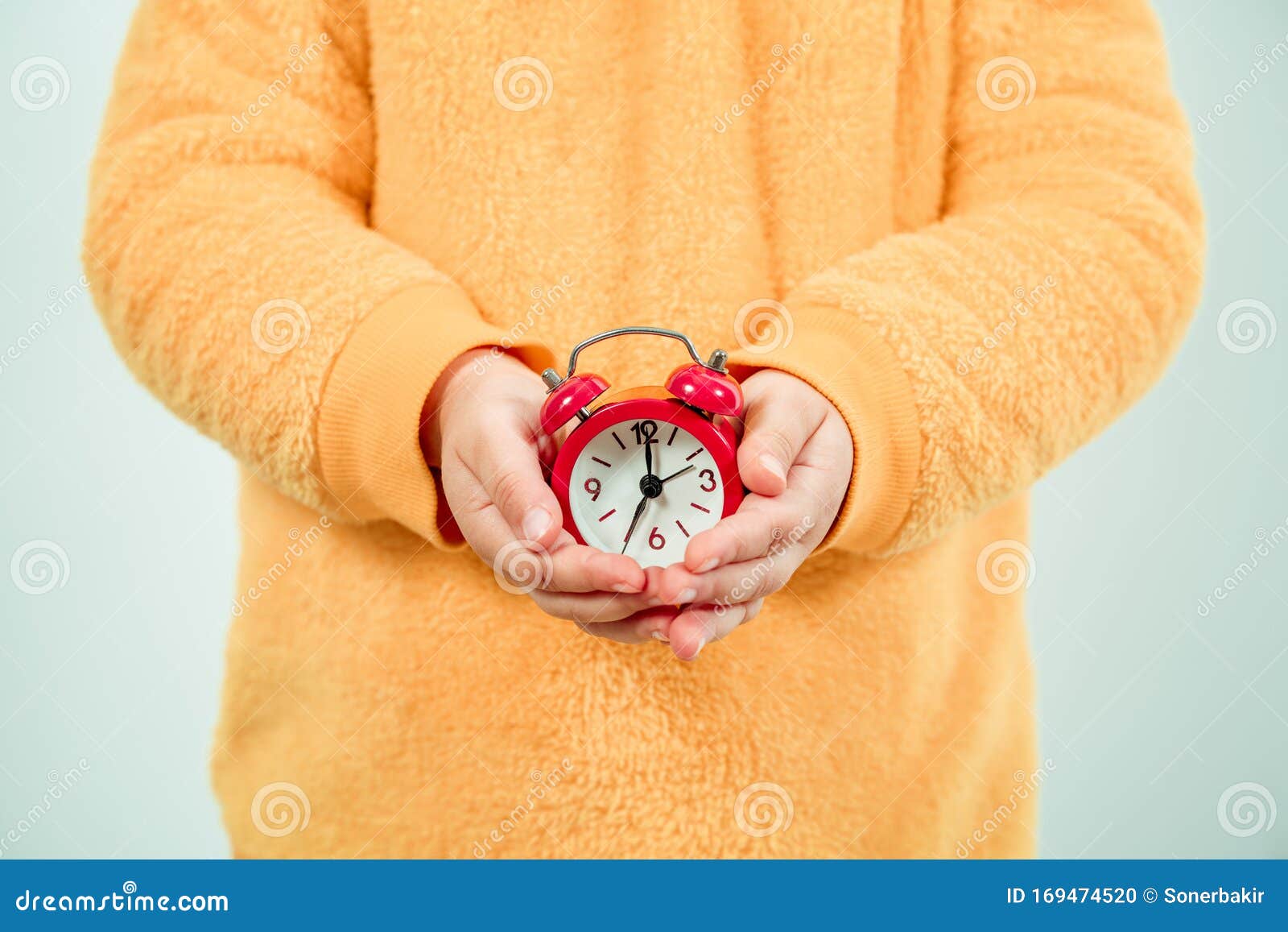 Adorable Child is Holding a Small Alarm Clock. Stock Photo - Image of ...
