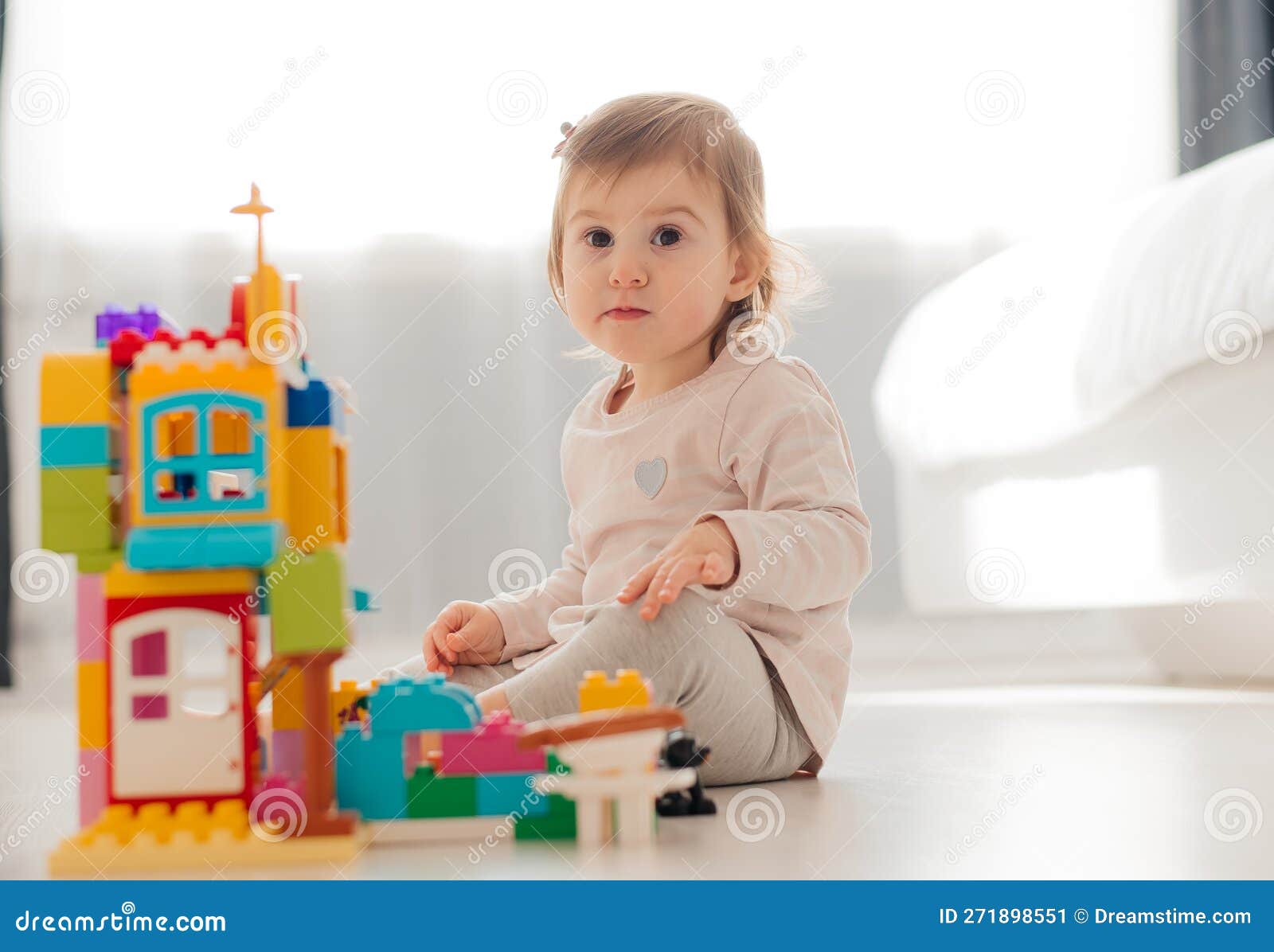 Adorable Child Playing with Multicolored Building Blocks on Floor Stock ...