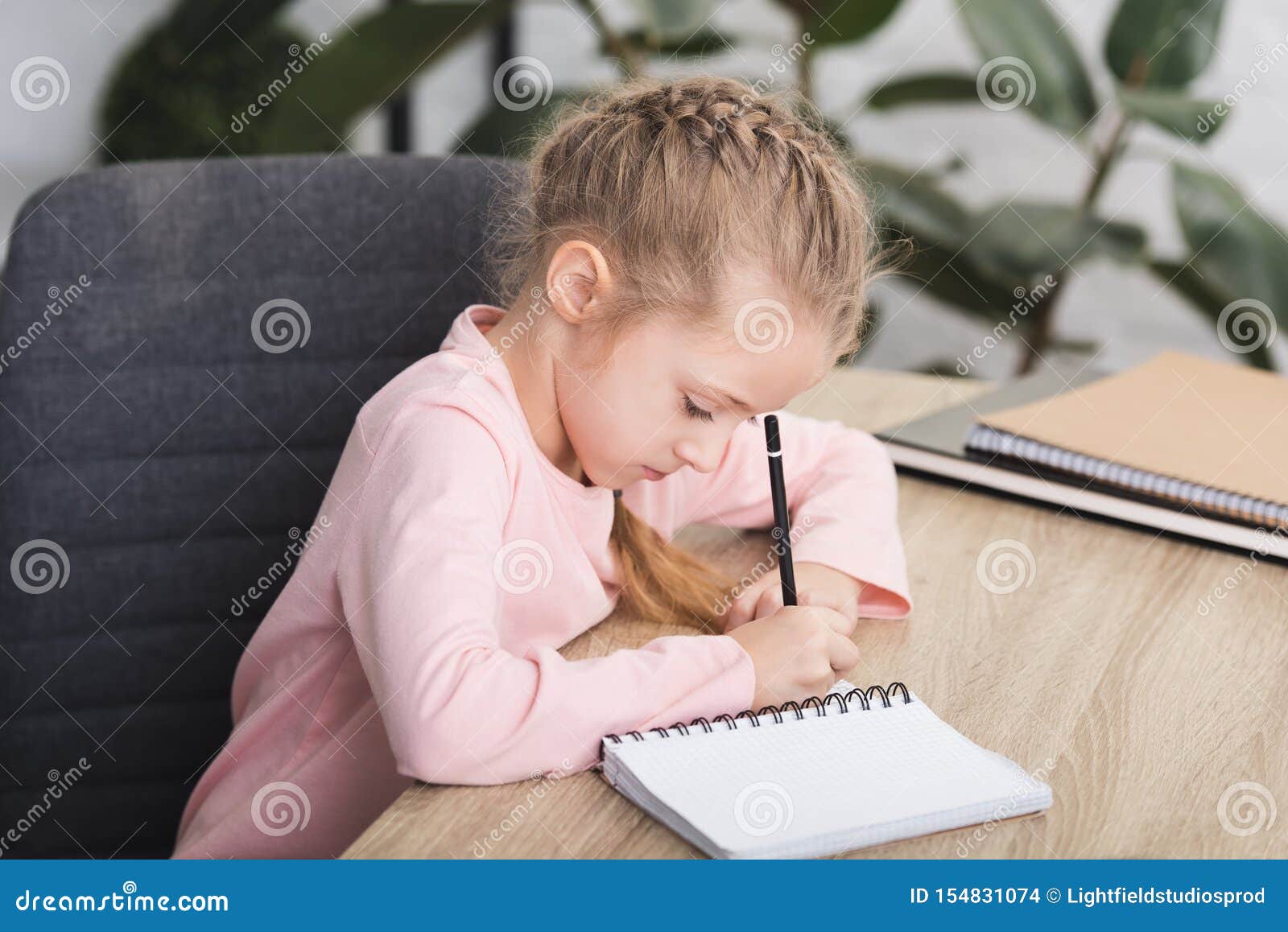 Adorable Child Sitting at Desk and Studying Stock Photo - Image of ...