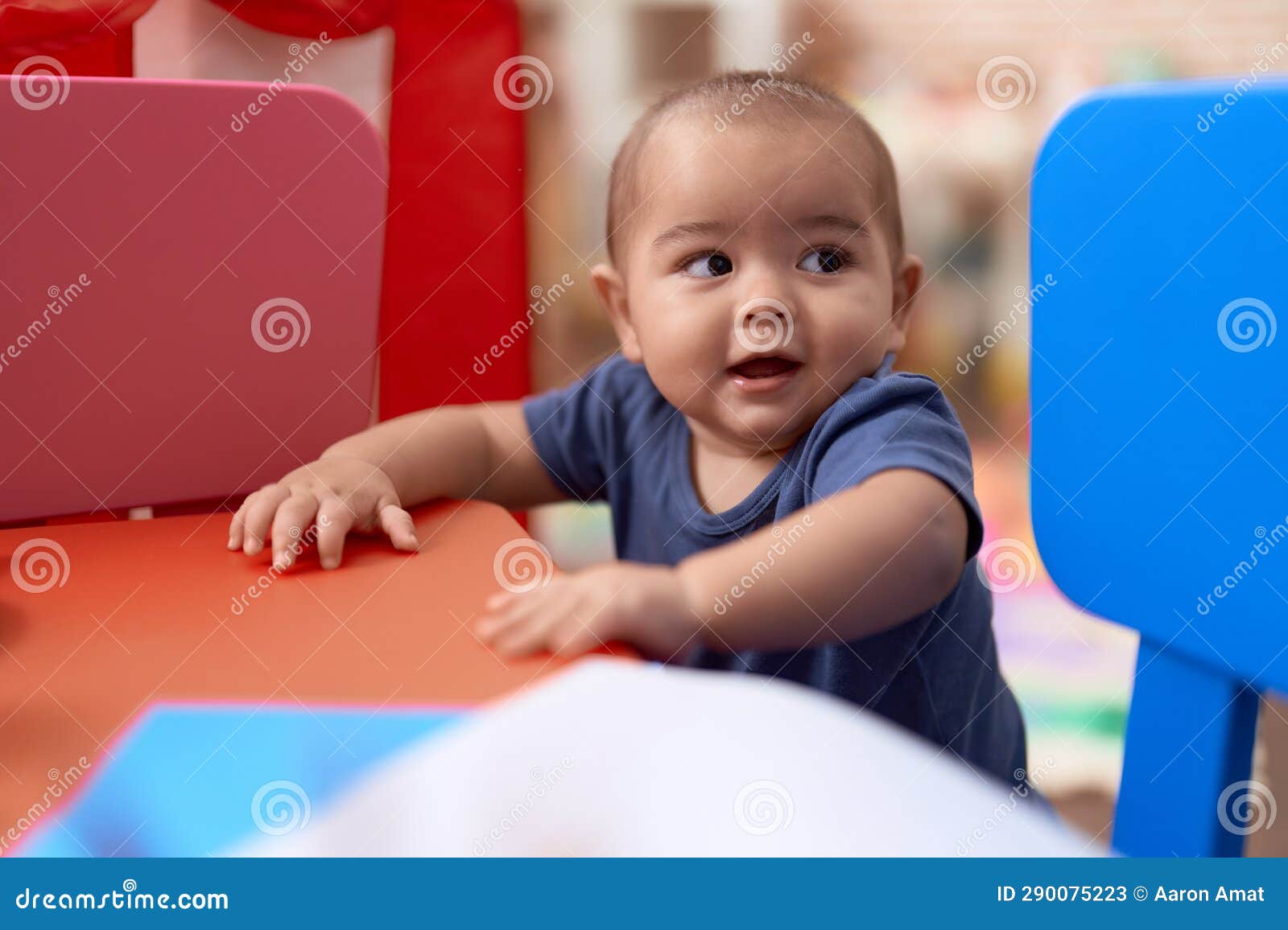 Adorable Chinese Toddler Leaning on Table Standing at Kindergarten ...