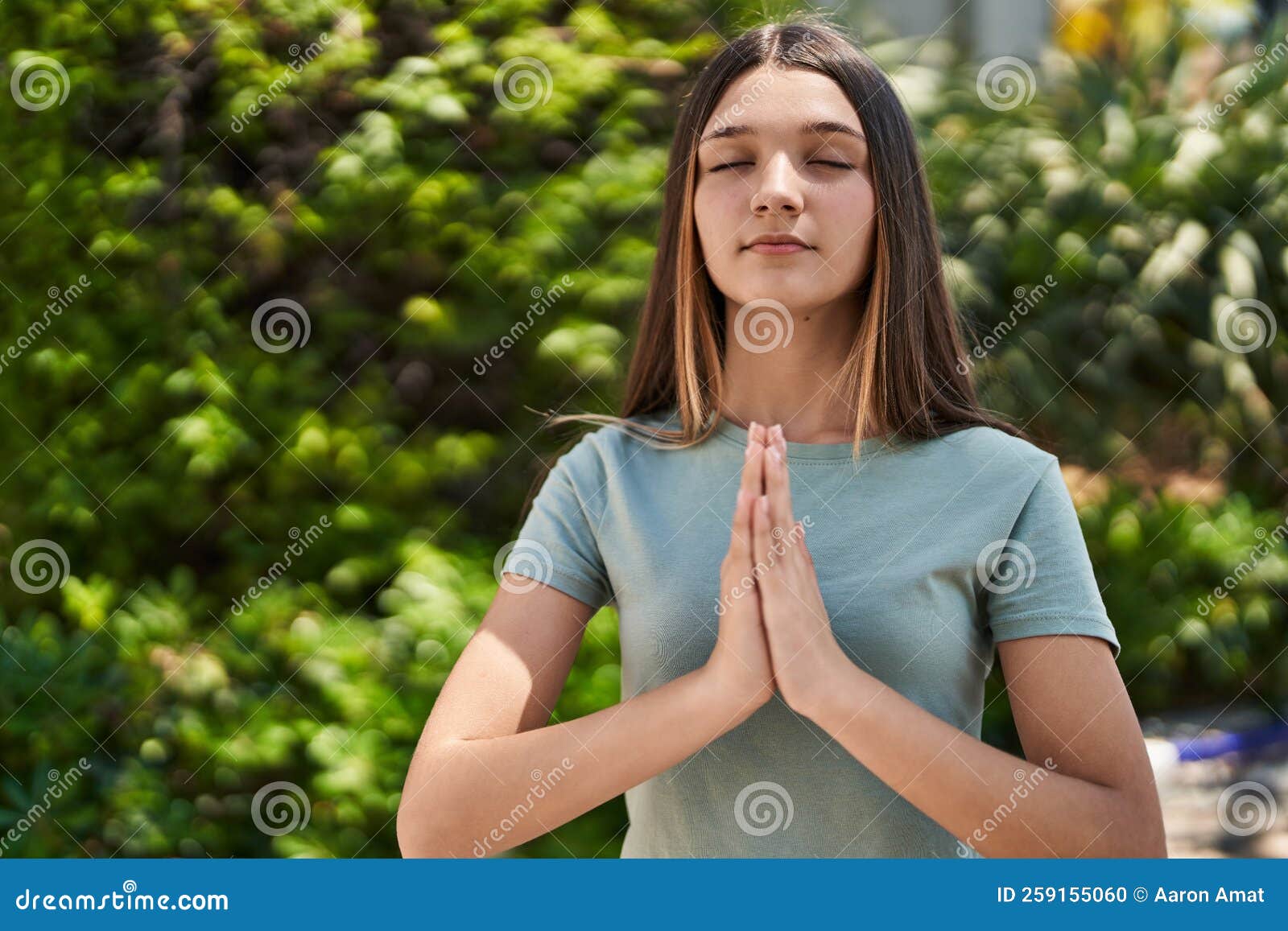 Adorable Girl Praying at Park Stock Photo - Image of pray, hands: 259155060
