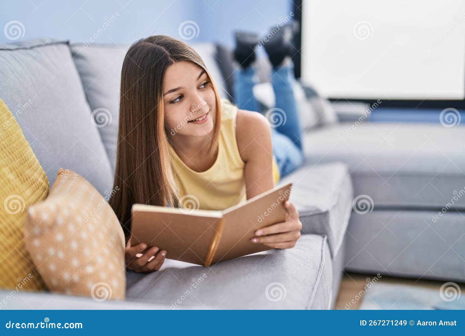 Adorable Girl Reading Book Lying on Sofa at Home Stock Image - Image of ...