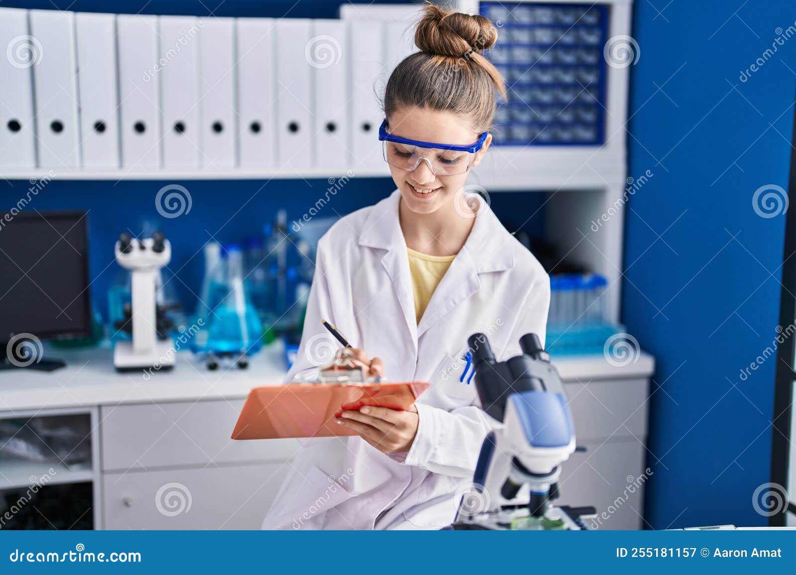 Adorable Girl Scientist Writing on Document Working at Laboratory Stock ...