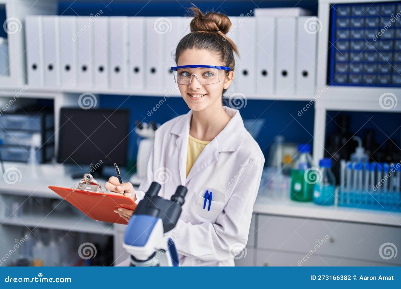 Adorable Girl Scientist Writing on Document Working at Laboratory Stock ...