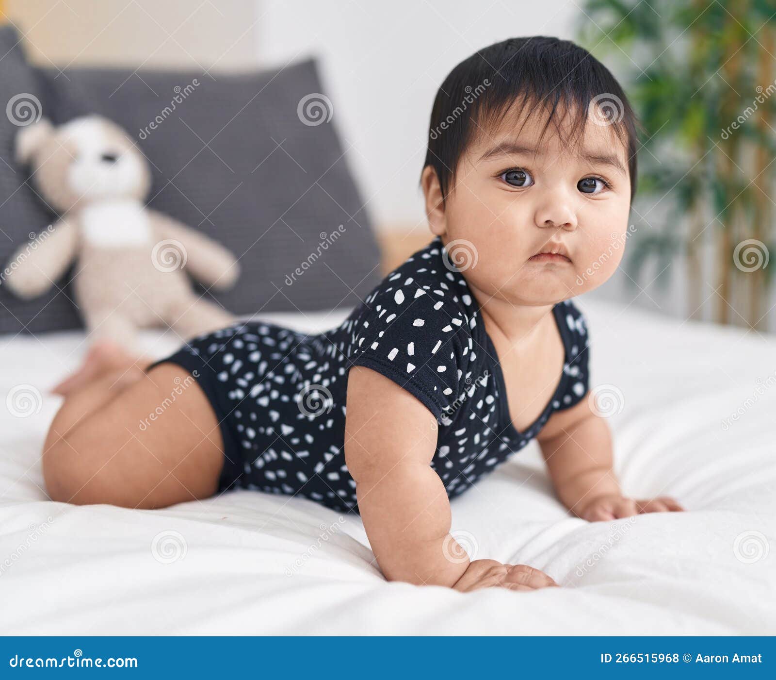 Adorable Hispanic Baby Lying on Bed at Bedroom Stock Photo - Image of ...