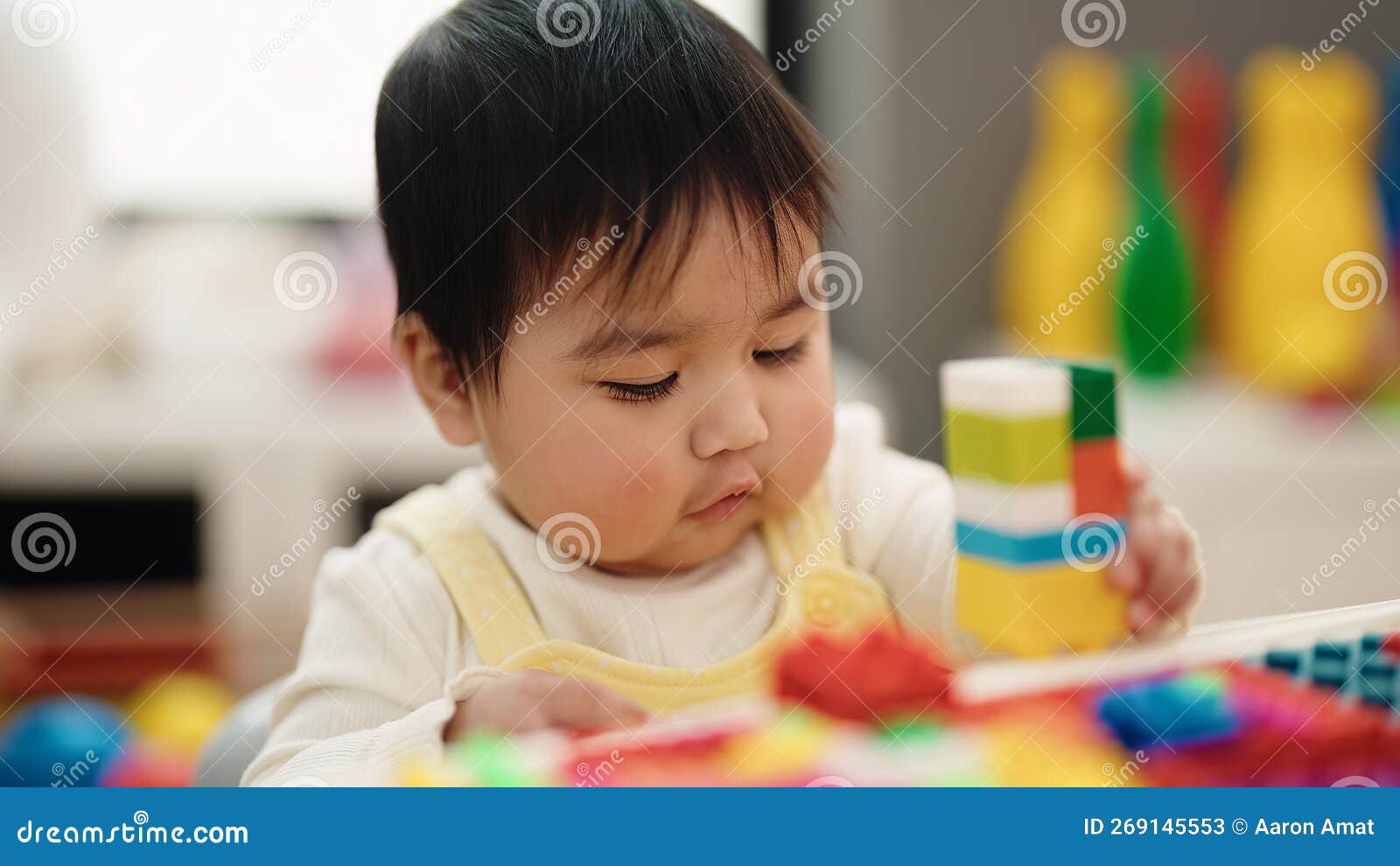 Adorable Hispanic Baby Playing with Construction Blocks Sitting on ...