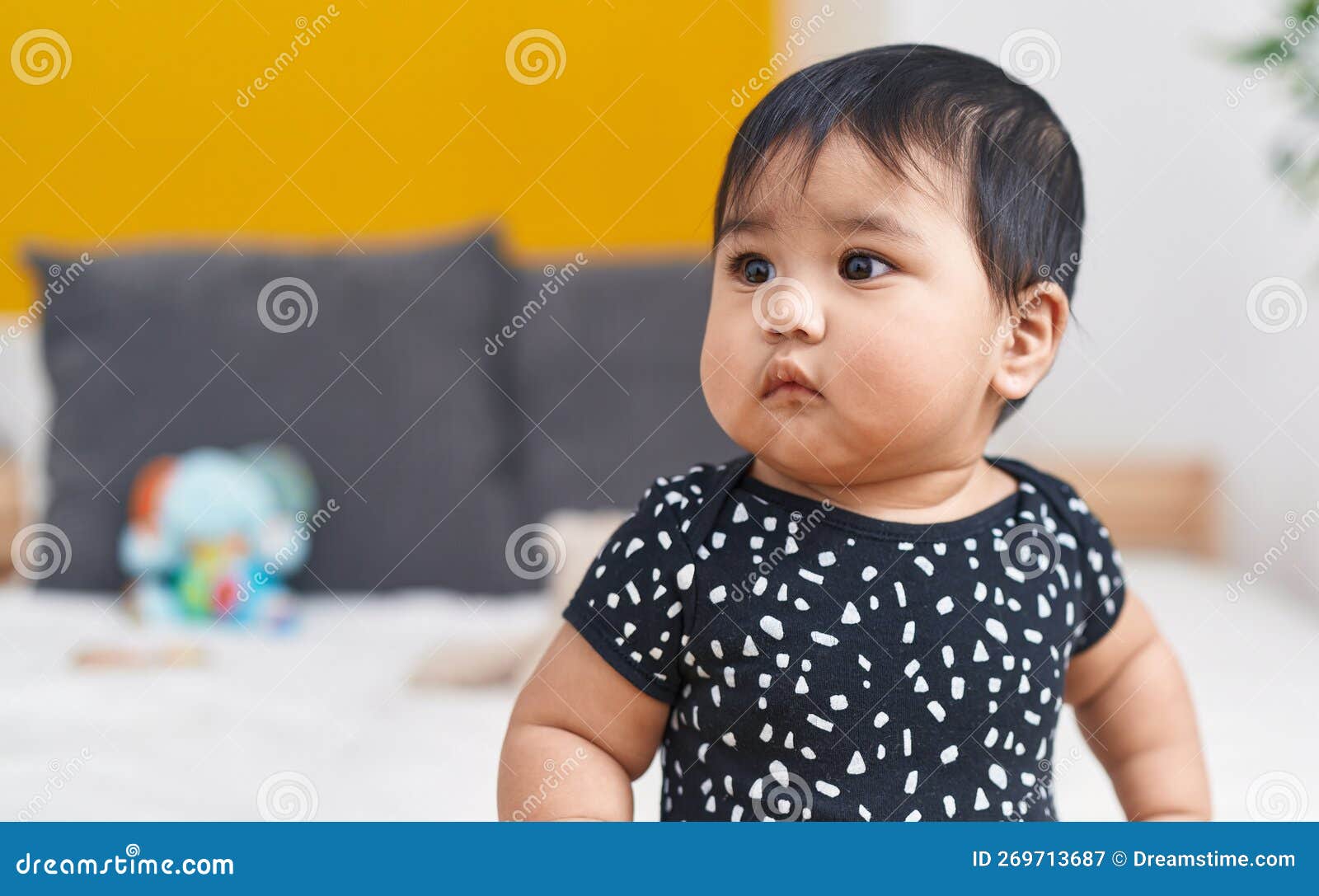 Adorable Hispanic Baby Sitting on Bed at Bedroom Stock Image - Image of ...