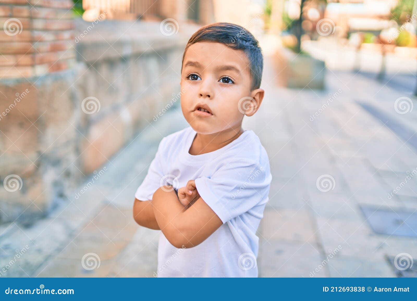 Adorable Hispanic Boy with Angry Expression Standing at the City Stock ...