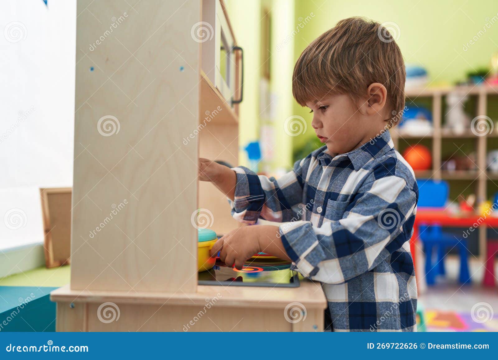 Adorable Hispanic Boy Playing with Play Kitchen Standing at ...