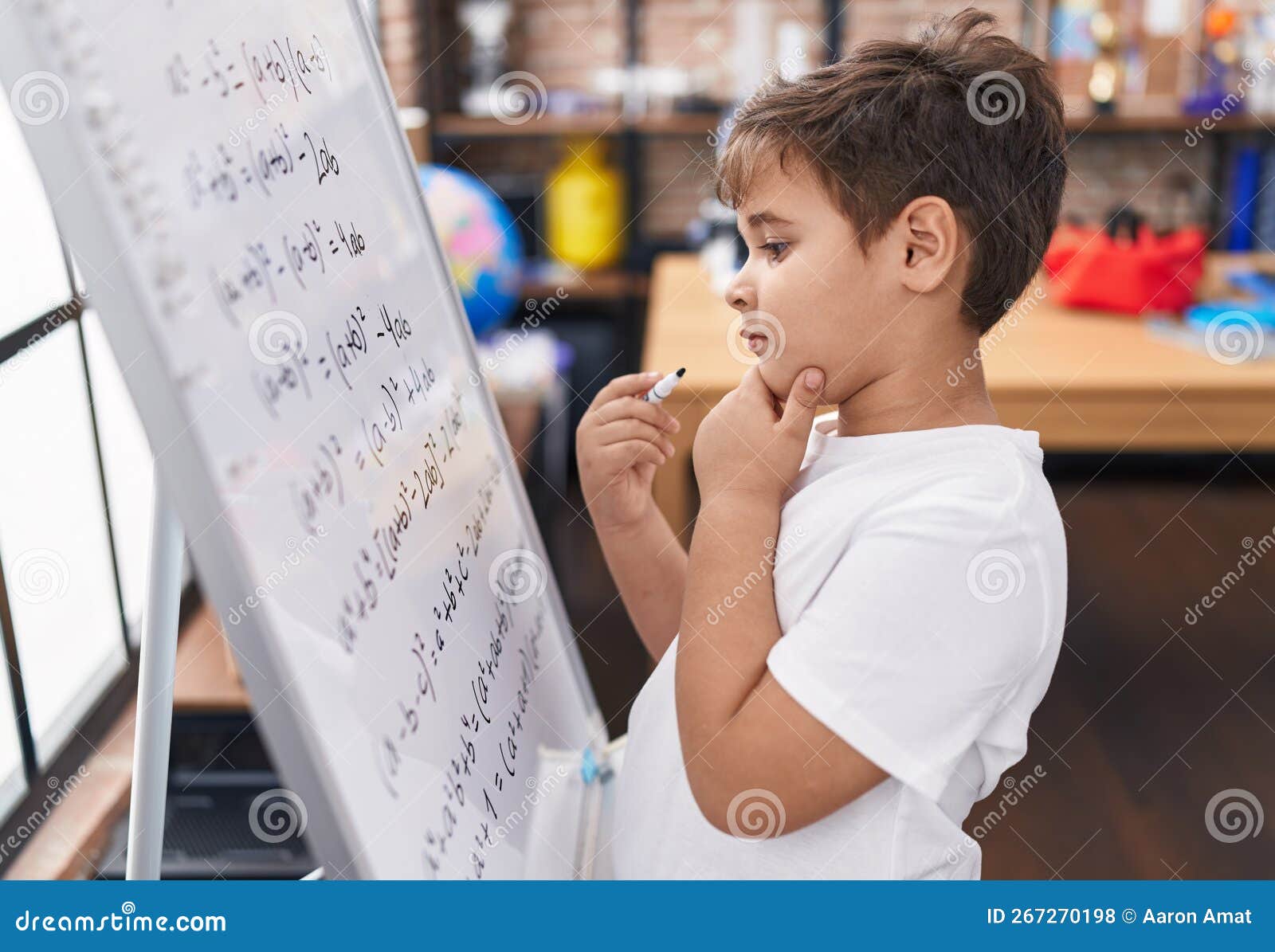 Adorable Hispanic Boy Preschool Student Writing on Chalkboard at ...