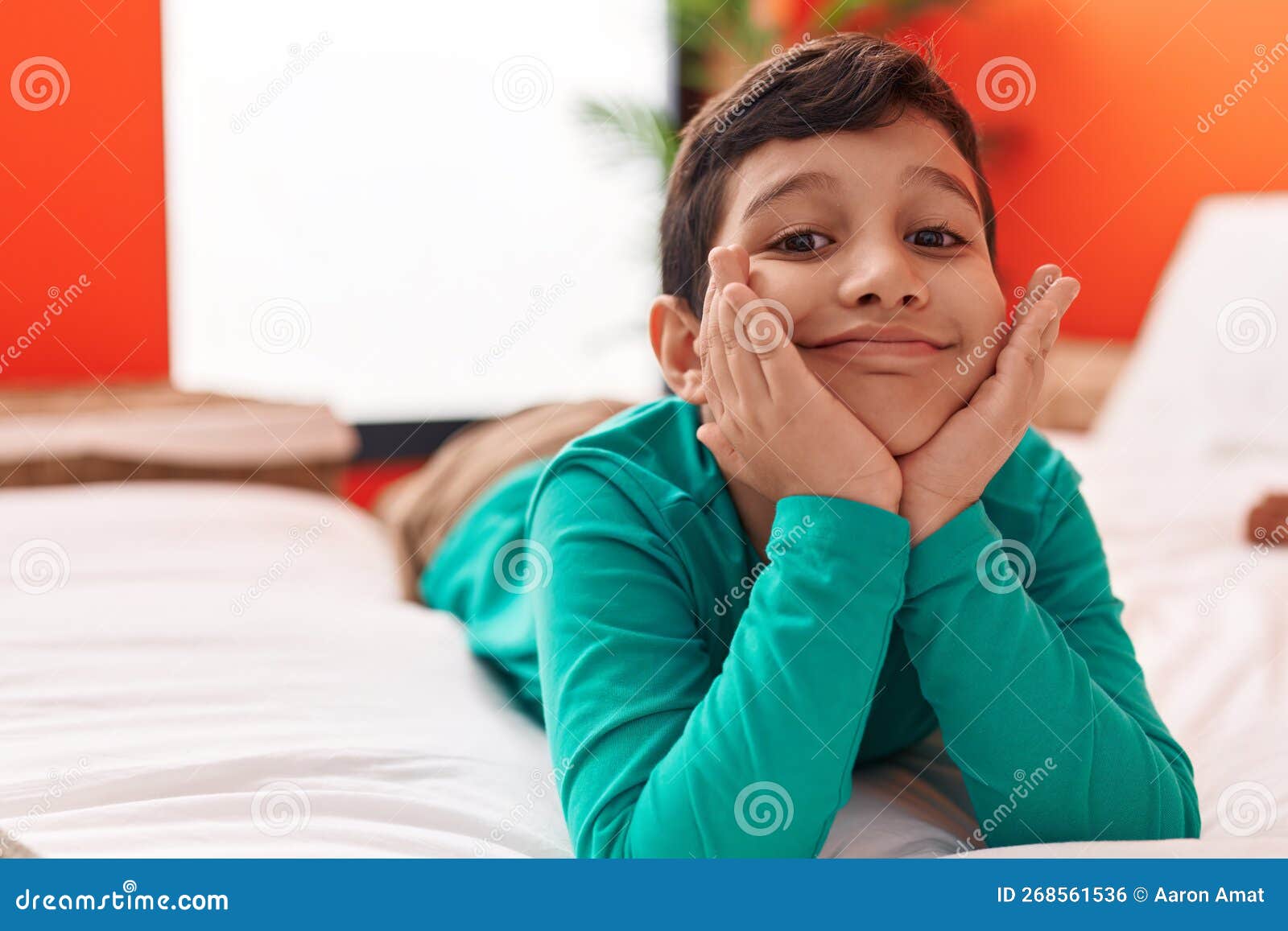 Adorable Hispanic Boy Smiling Confident Lying on Bed at Bedroom Stock ...