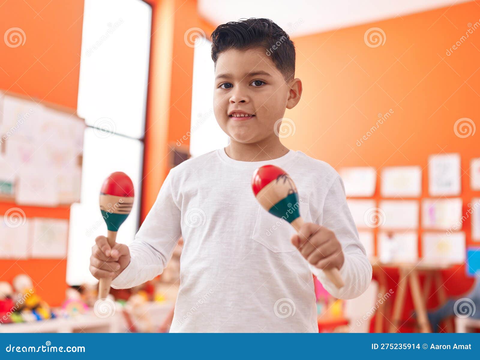 Adorable Hispanic Boy Smiling Confident Playing Maraca at Kindergarten ...