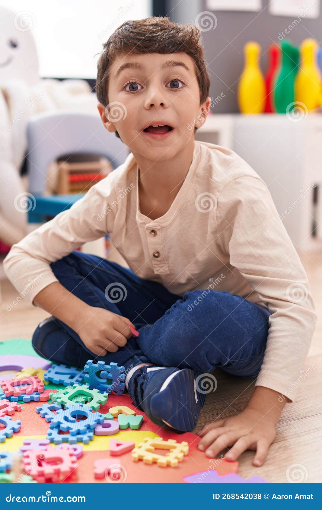 Adorable Hispanic Boy Smiling Confident Sitting on Floor at ...