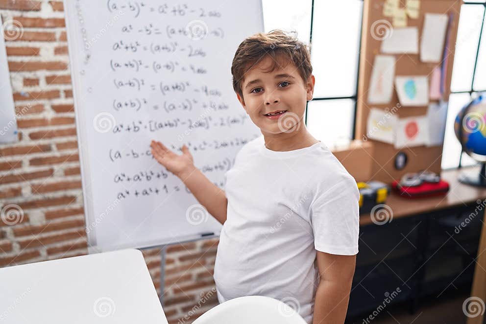 Adorable Hispanic Boy Smiling Confident Standing by Chalkboard with ...