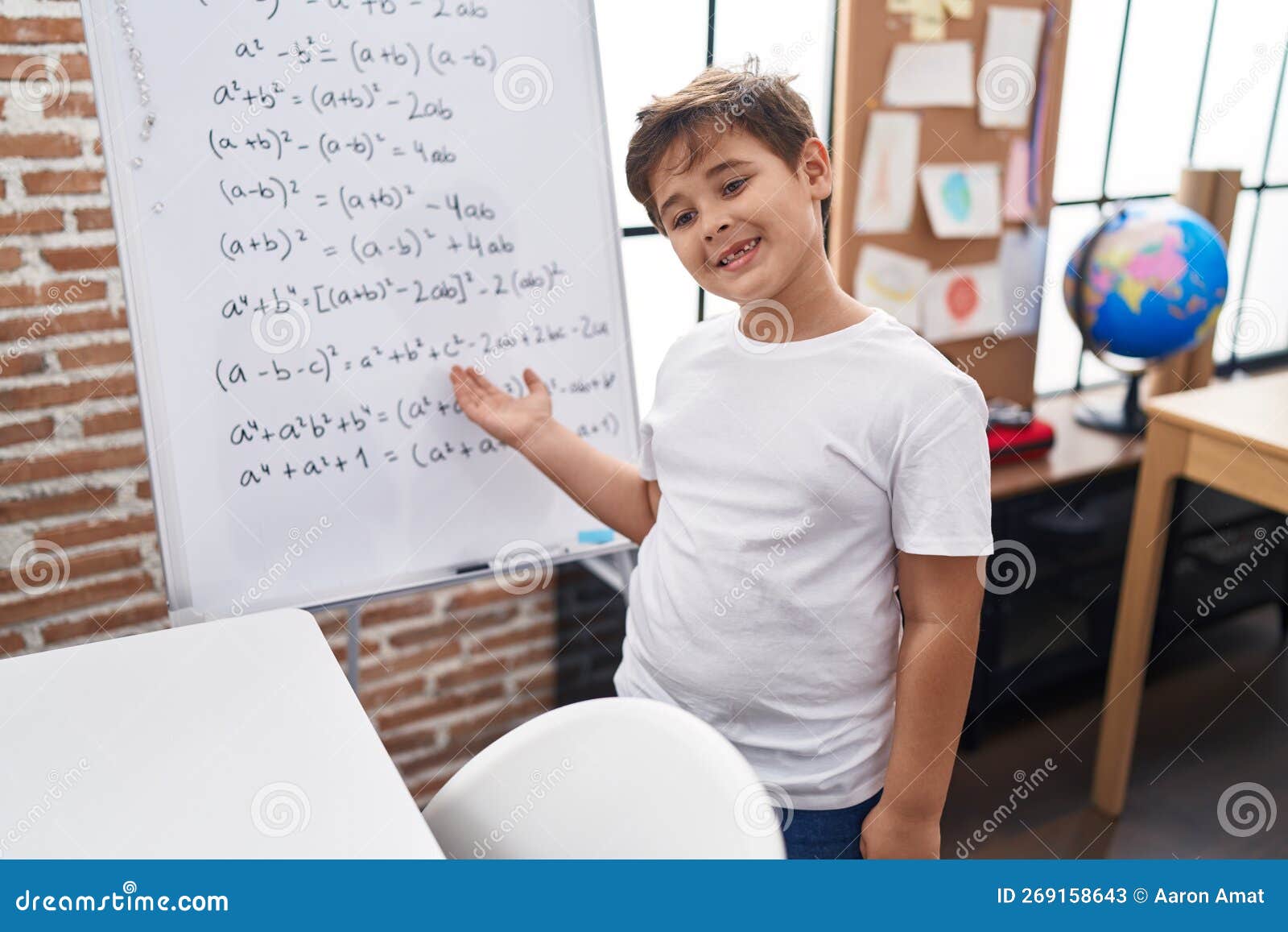 Adorable Hispanic Boy Smiling Confident Standing by Chalkboard with ...