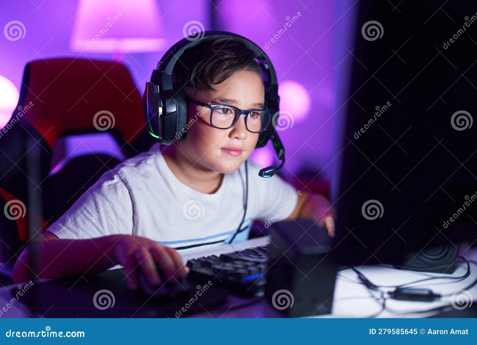 Adorable Hispanic Boy Streamer Playing Video Game Using Computer at ...