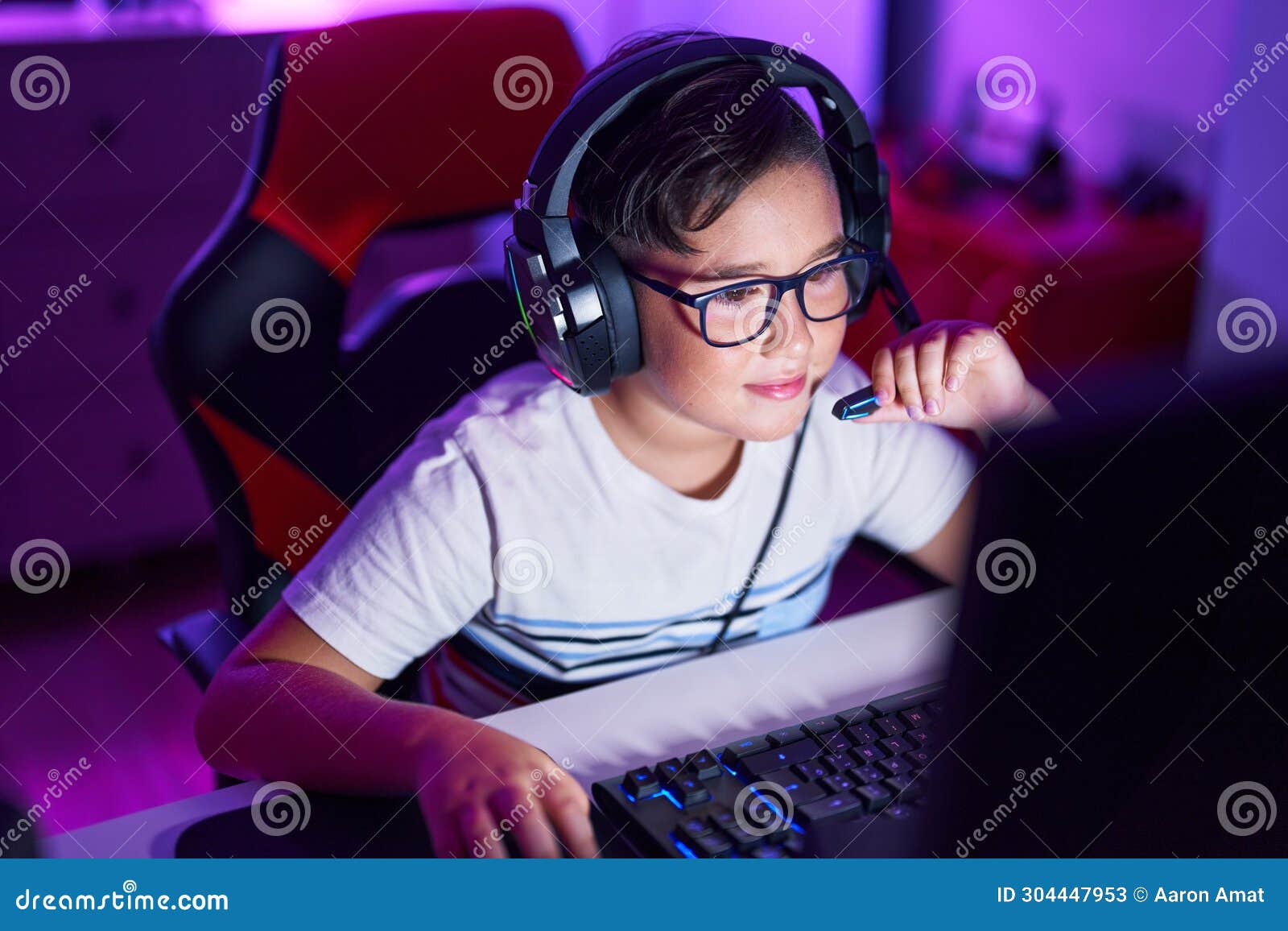 Adorable Hispanic Boy Streamer Playing Video Game Using Computer at ...