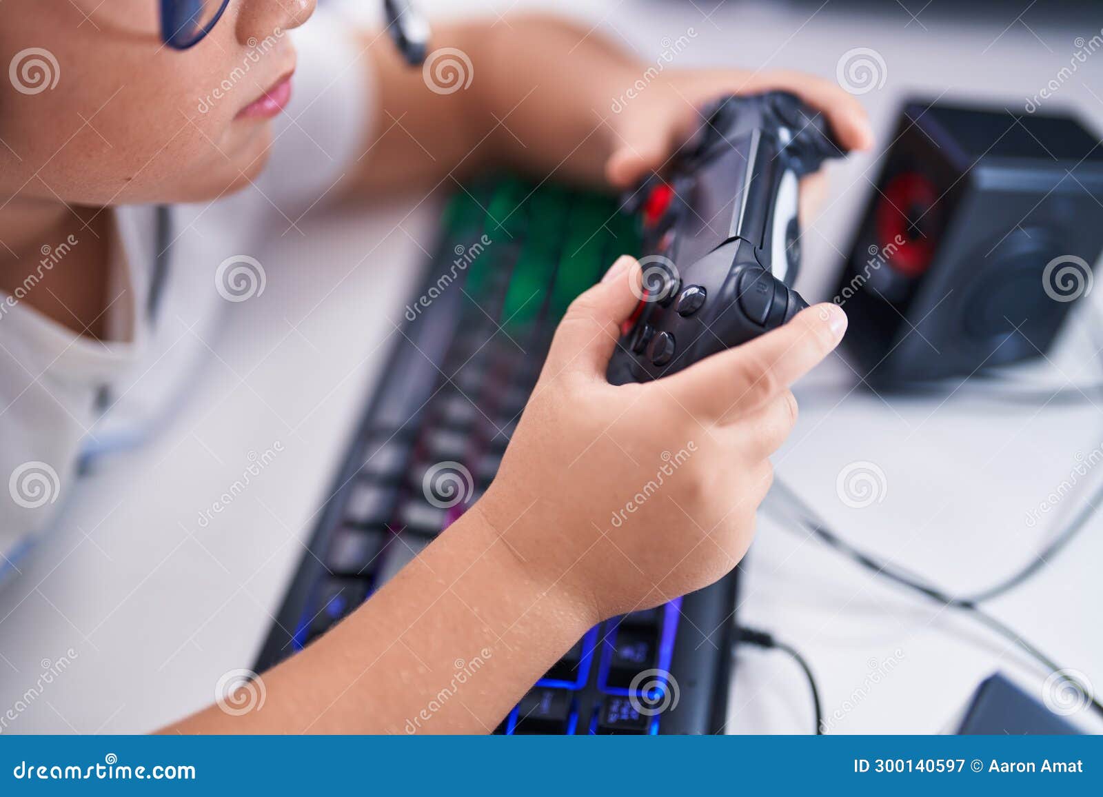 Adorable Hispanic Boy Streamer Playing Video Game Using Joystick at ...