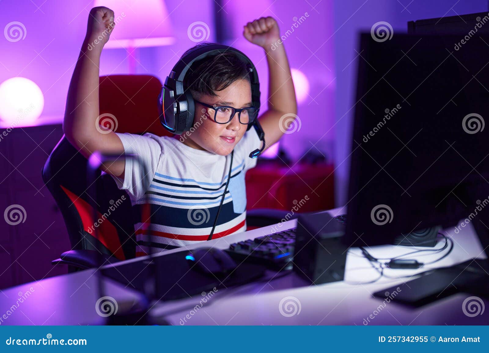 Adorable Hispanic Boy Streamer Playing Video Game with Winner ...