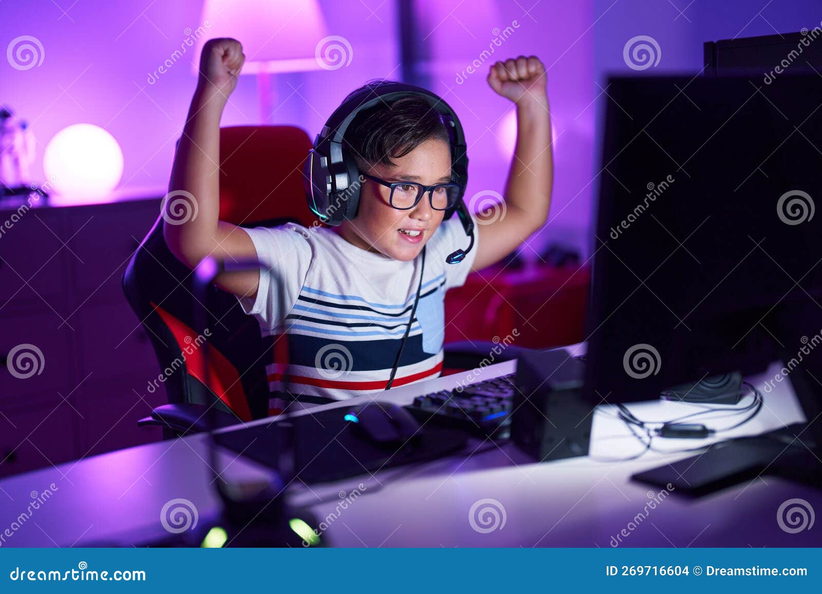 Adorable Hispanic Boy Streamer Playing Video Game with Winner ...