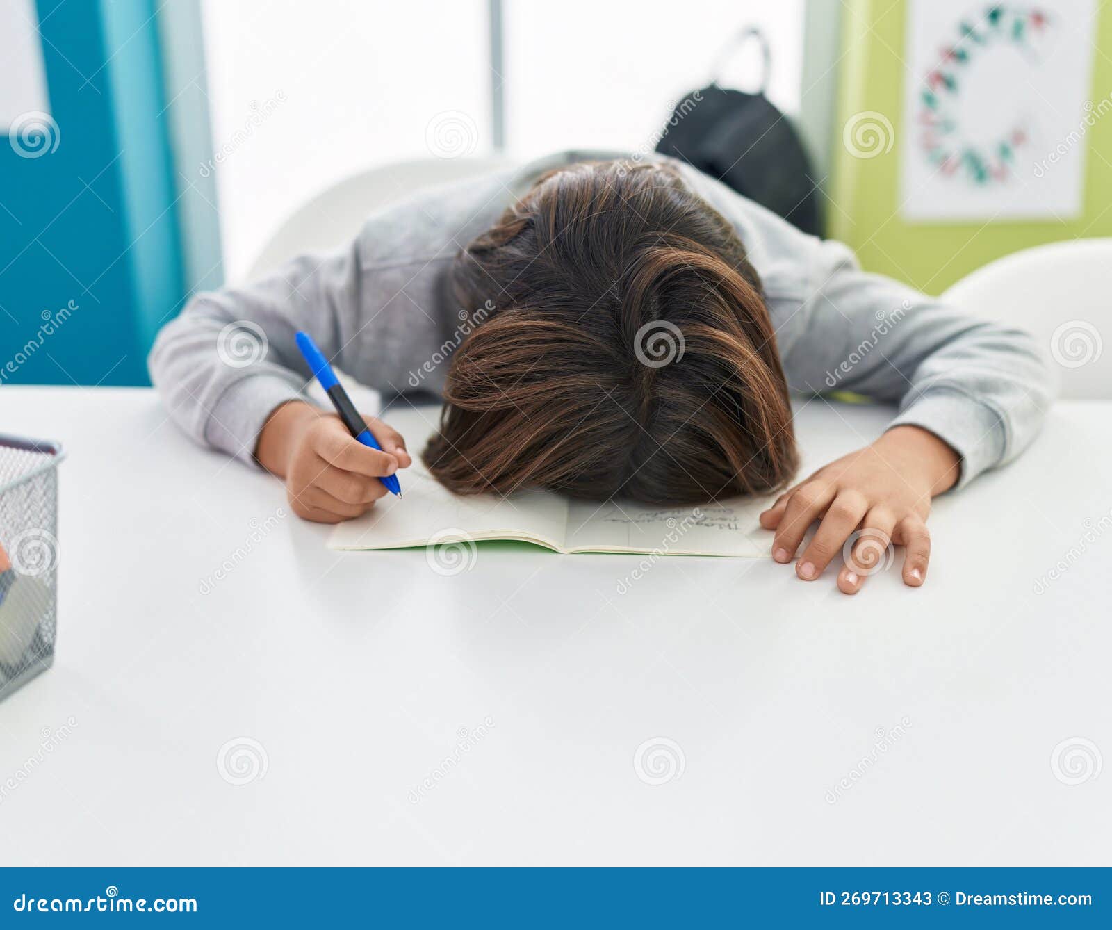Adorable Hispanic Boy Student with Head on Table Stressed at Classroom Stock Image - Image of ...