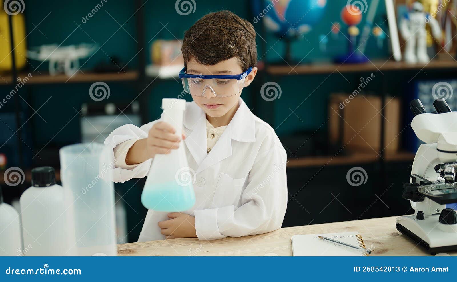 Adorable Hispanic Boy Student Holding Test Tube at Laboratory Classroom ...