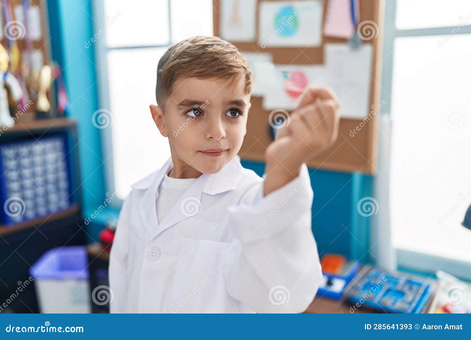 Adorable Hispanic Boy Student Looking Sample at Laboratory Classroom ...