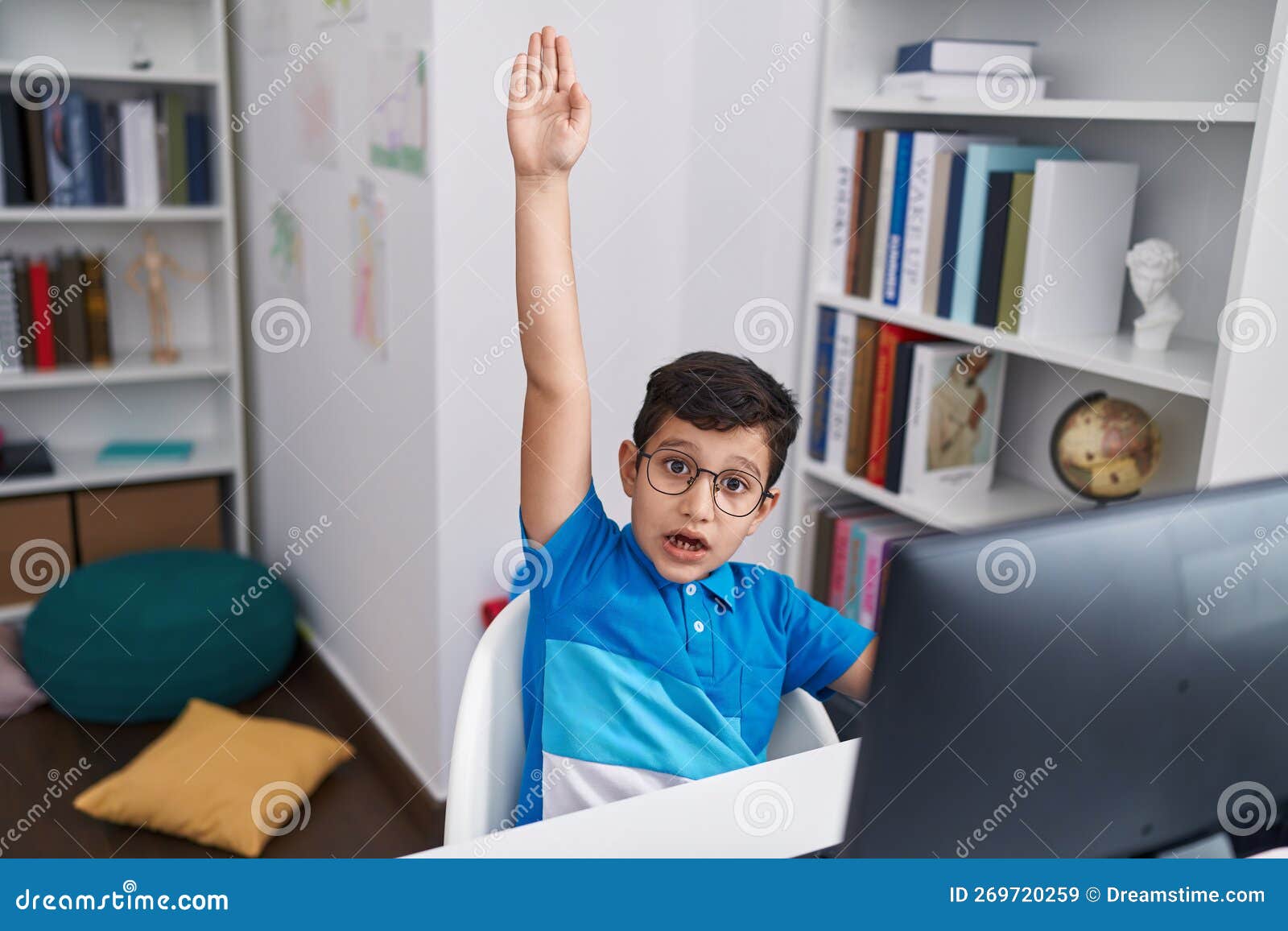 Adorable Hispanic Boy Student Using Computer with Hand Raised Up at ...