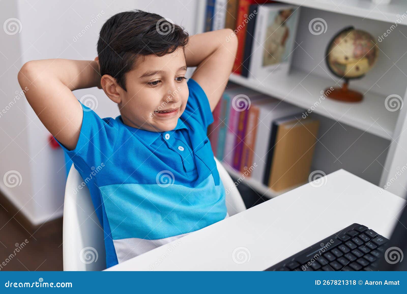 Adorable Hispanic Boy Student Using Computer Relaxed with Hands on Head ...