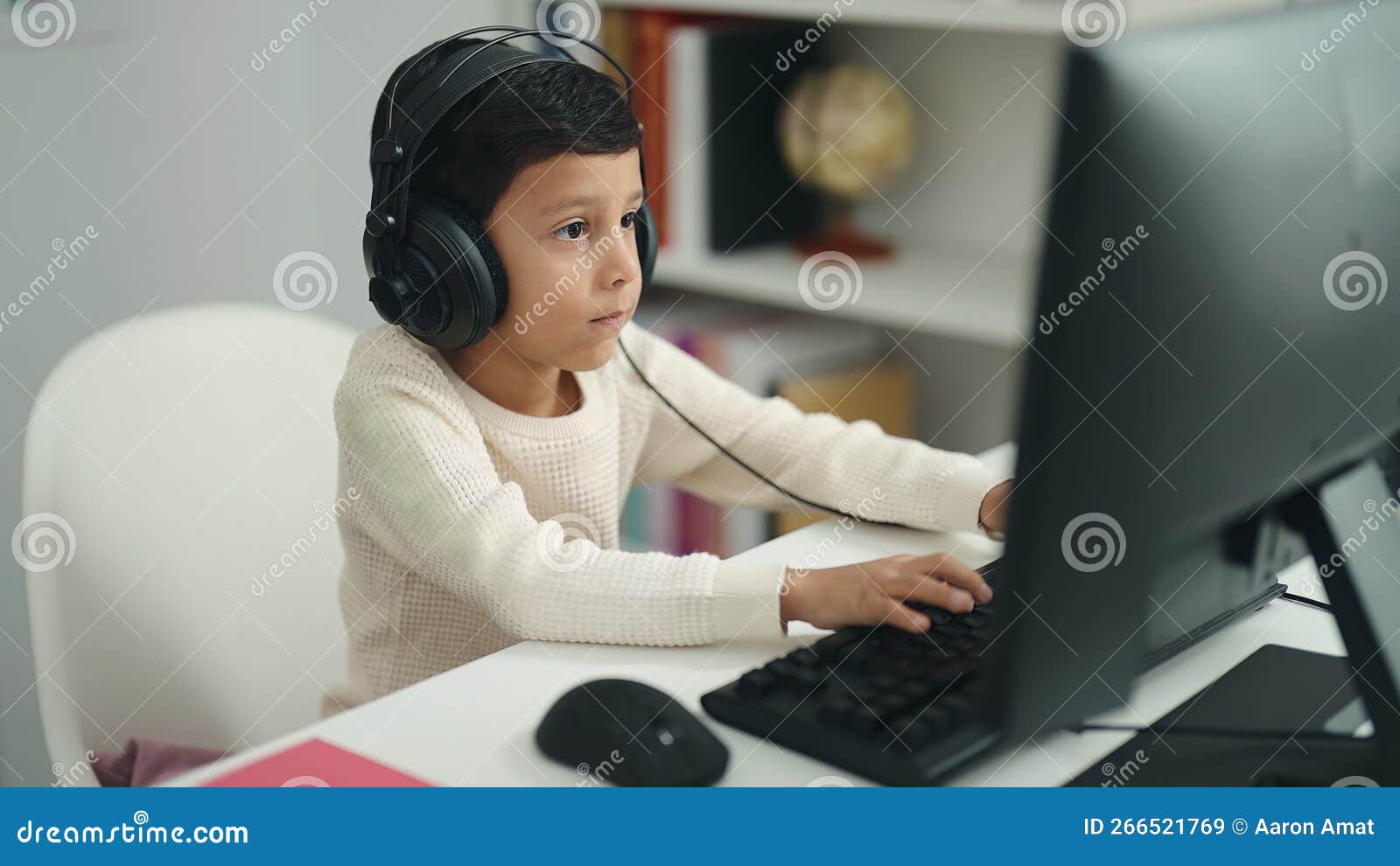 Adorable Hispanic Boy Student Using Computer Sitting on Table at ...