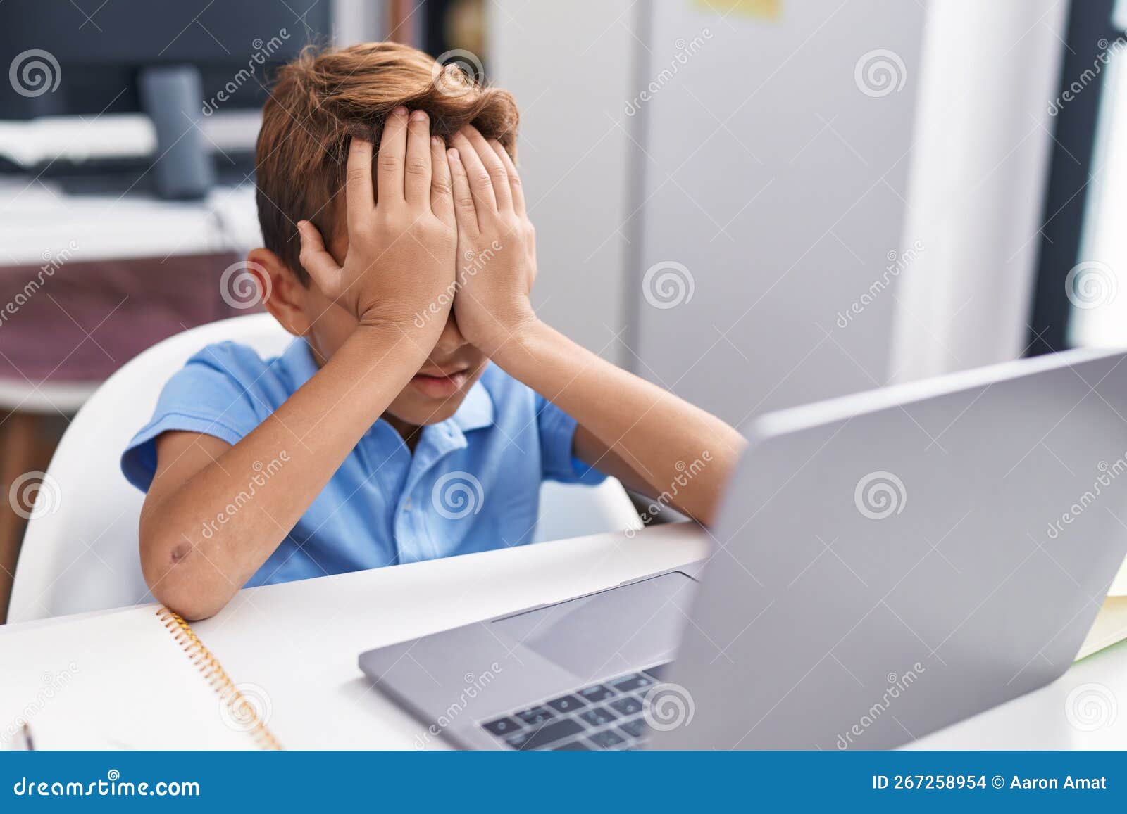 Adorable Hispanic Boy Student Using Computer with Stressed Expression ...