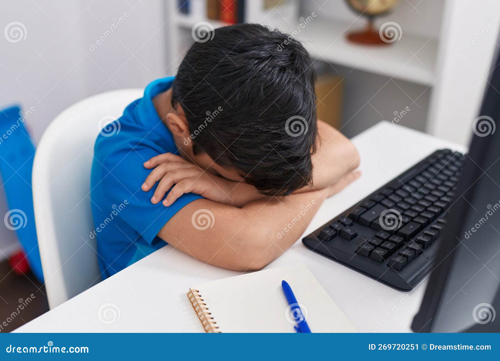 Adorable Hispanic Boy Student Using Computer with Stressed Expression ...