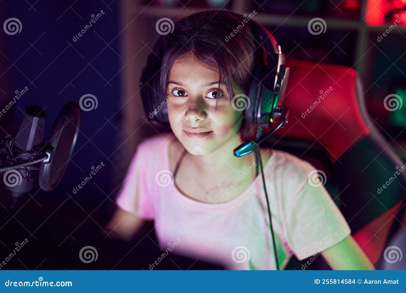 Adorable Hispanic Girl Streamer Playing Video Game Using Computer at ...