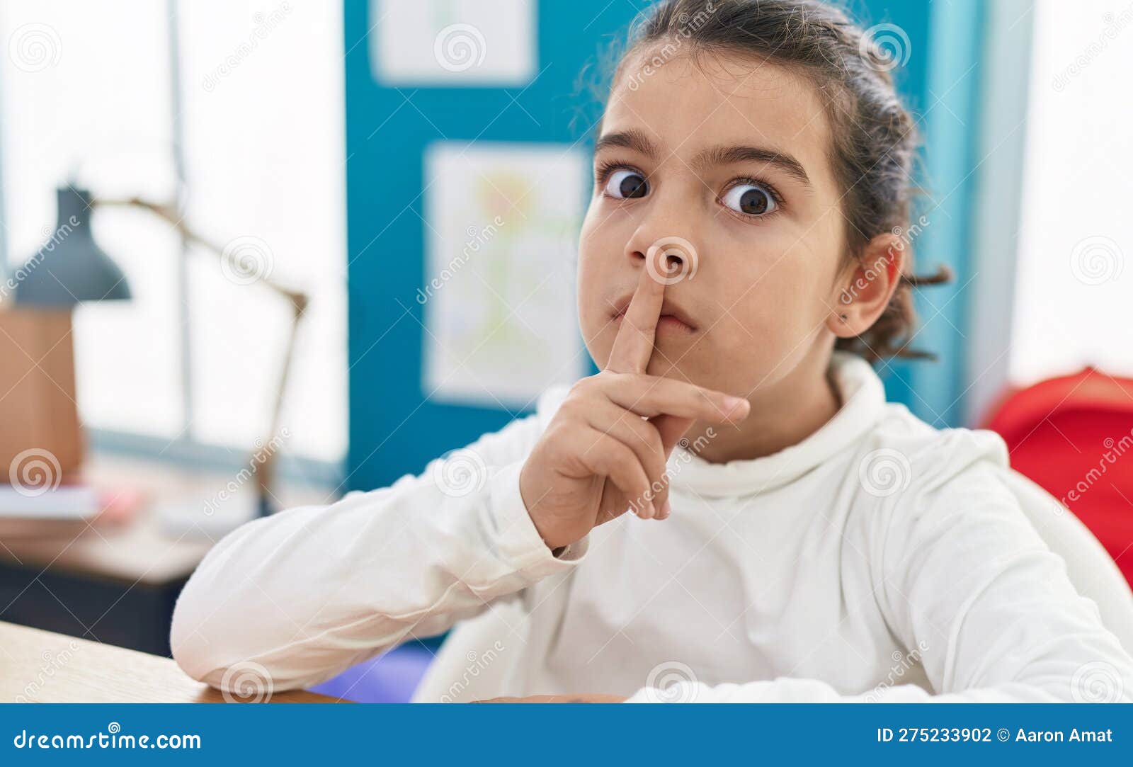 Adorable Hispanic Girl Student Asking for Silence at Classroom Stock ...