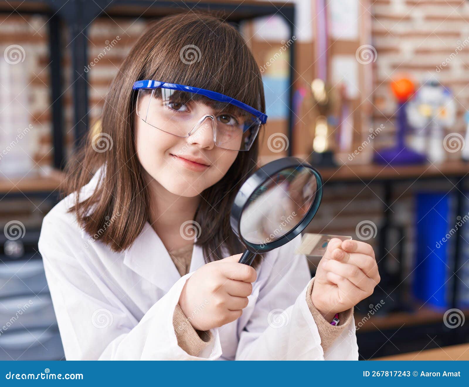Adorable Hispanic Girl Student Looking Sample Using Magnifying Glass at ...