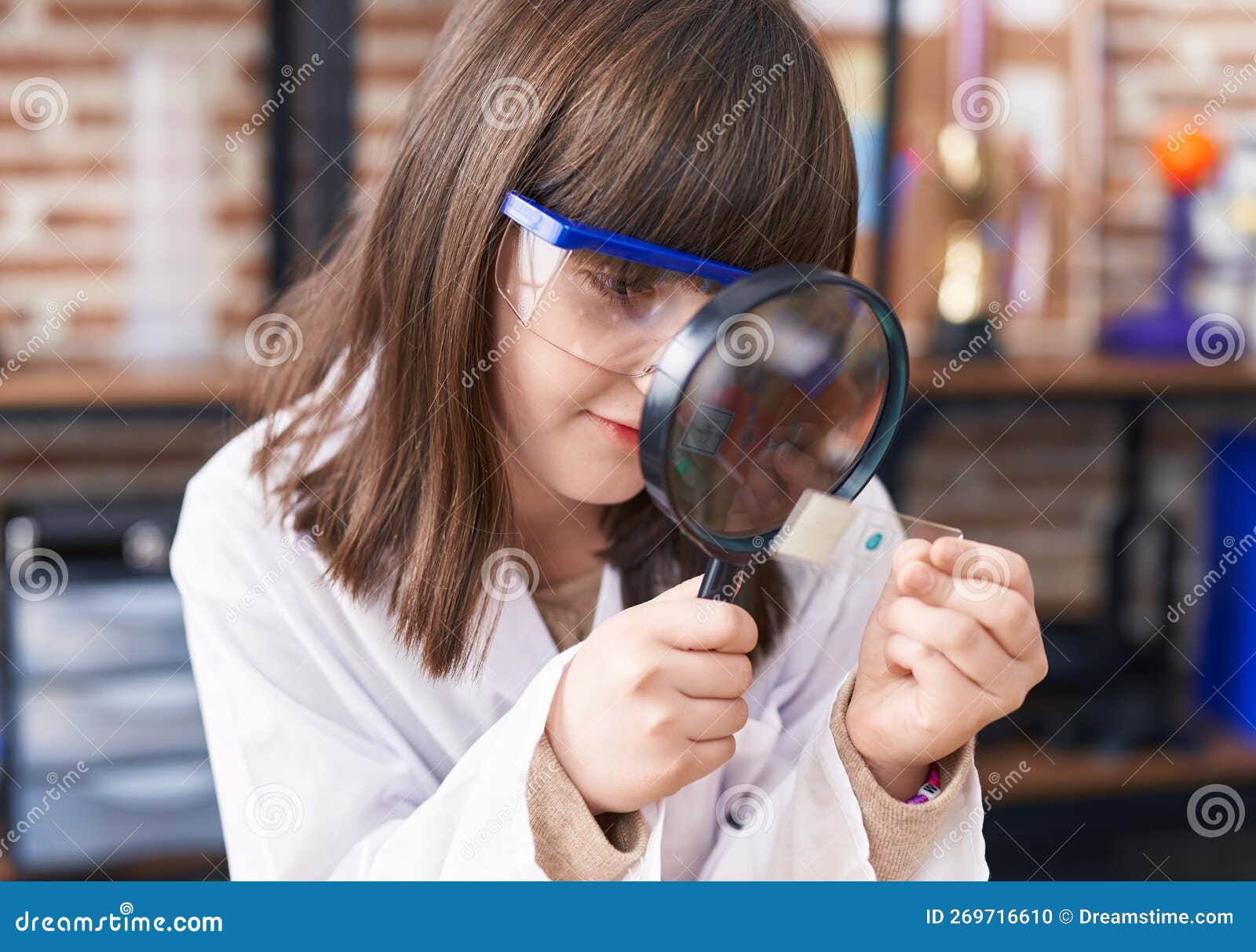 Adorable Hispanic Girl Student Looking Sample Using Magnifying Glass at ...